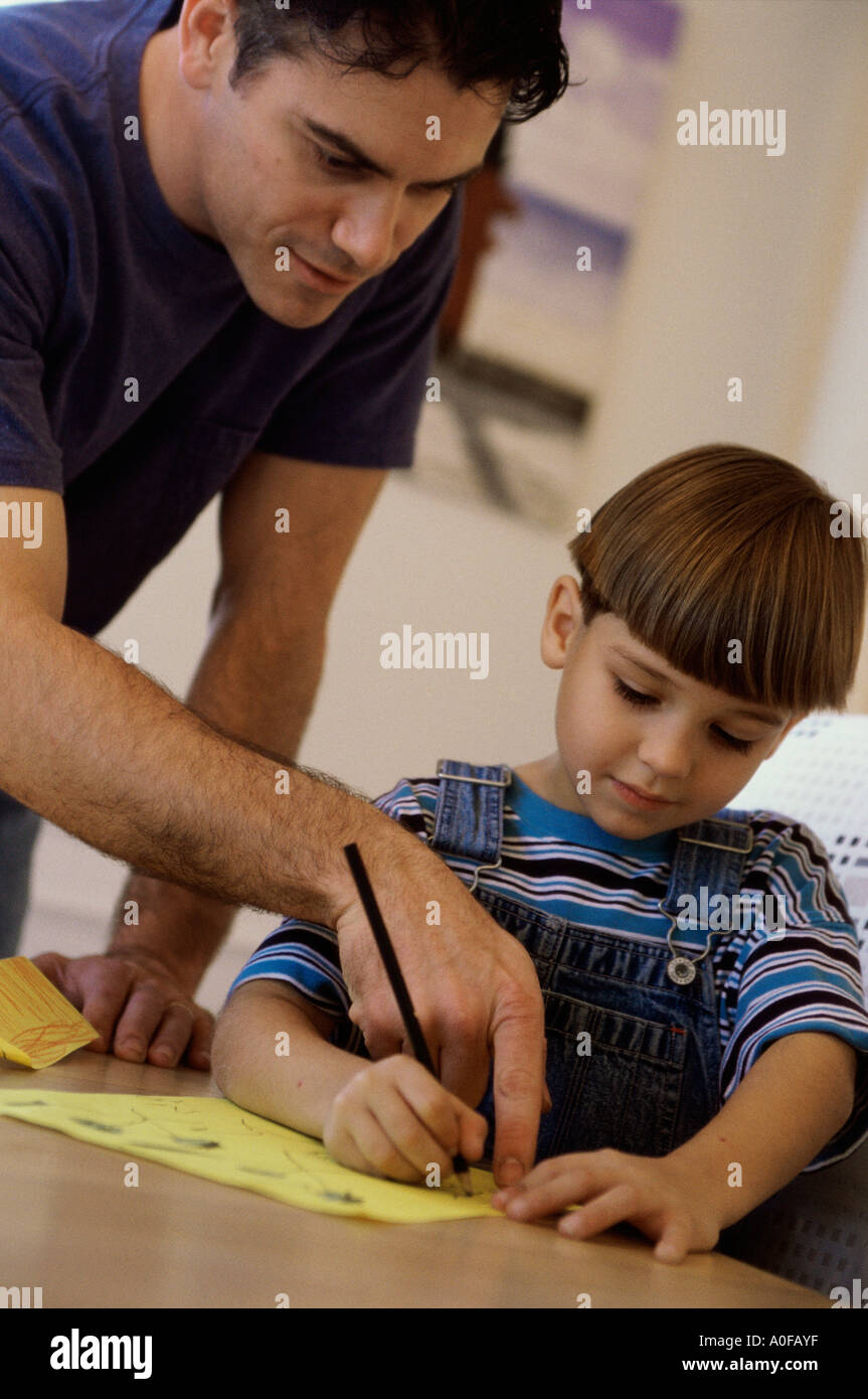 Father drawing with his son Stock Photo - Alamy