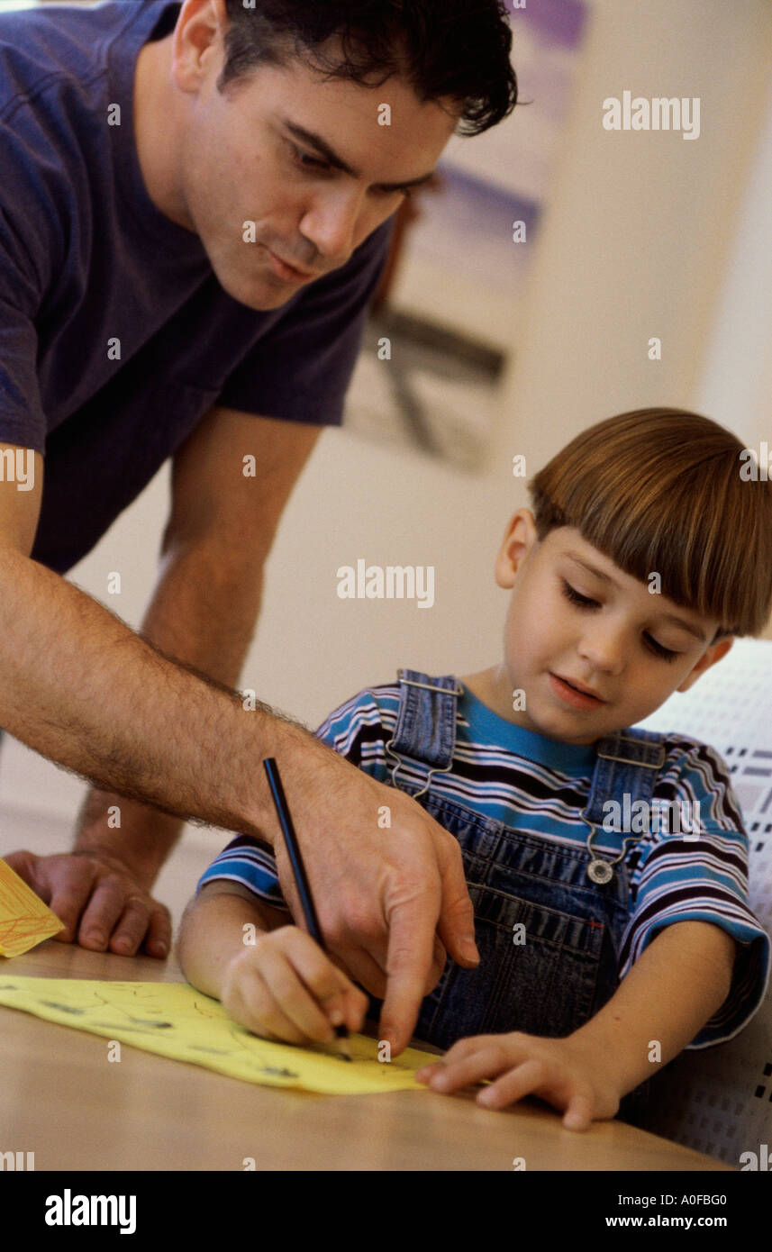 Father drawing with his son Stock Photo - Alamy