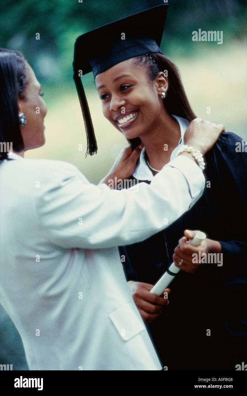 Female graduate standing with her mother Stock Photo - Alamy