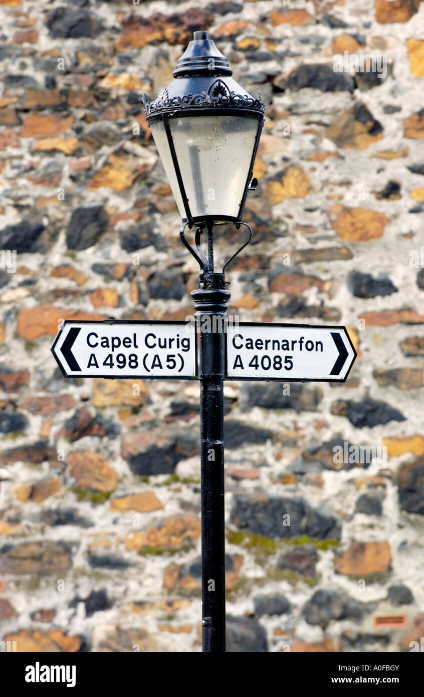 Lampost with direction signs in Beddgelert Gwynedd North Wales UK Stock ...