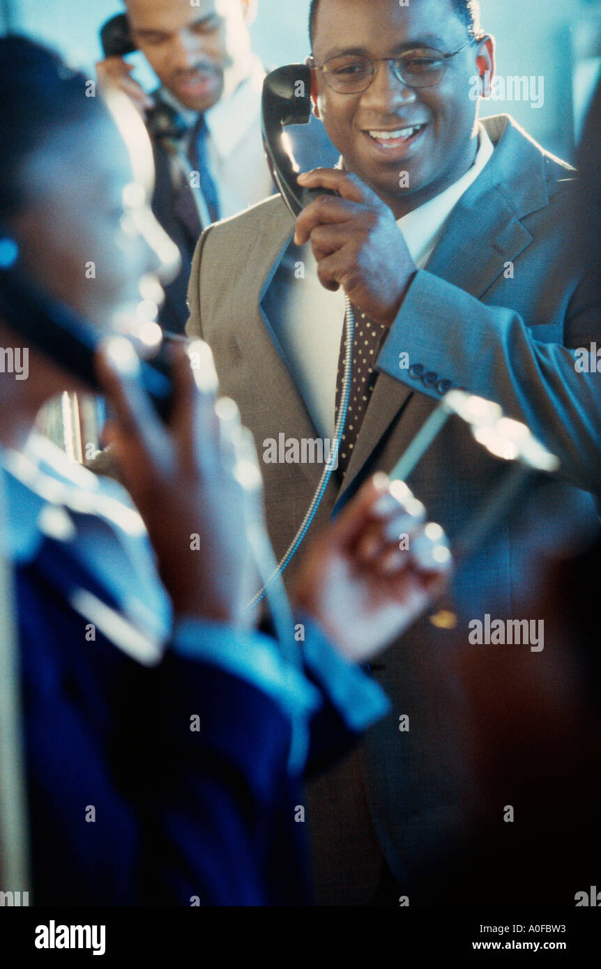 Business executives using pay phones Stock Photo - Alamy