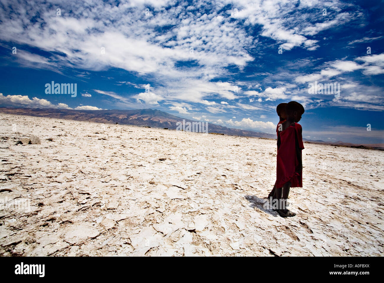 Masai children at dried out Lake Natron, Ol' Donyo Lengai volcano ...