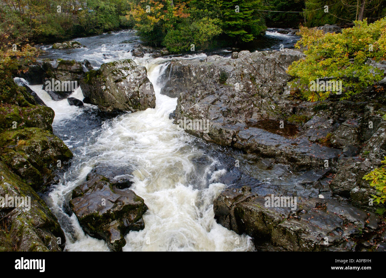 Fast flowing River Llugwy running through the Snowdonia village of ...