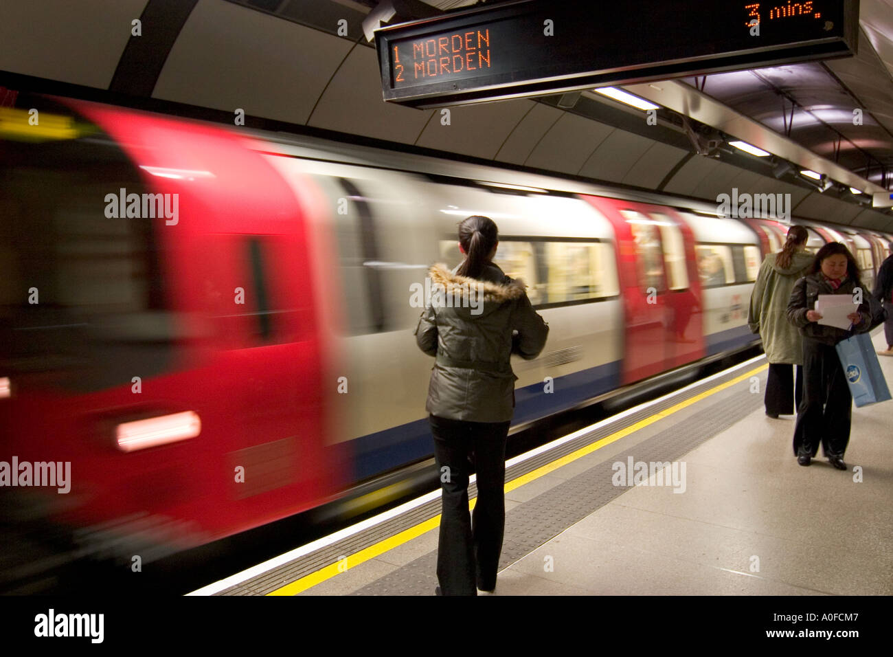 Passengers wait on platform hi-res stock photography and images - Alamy