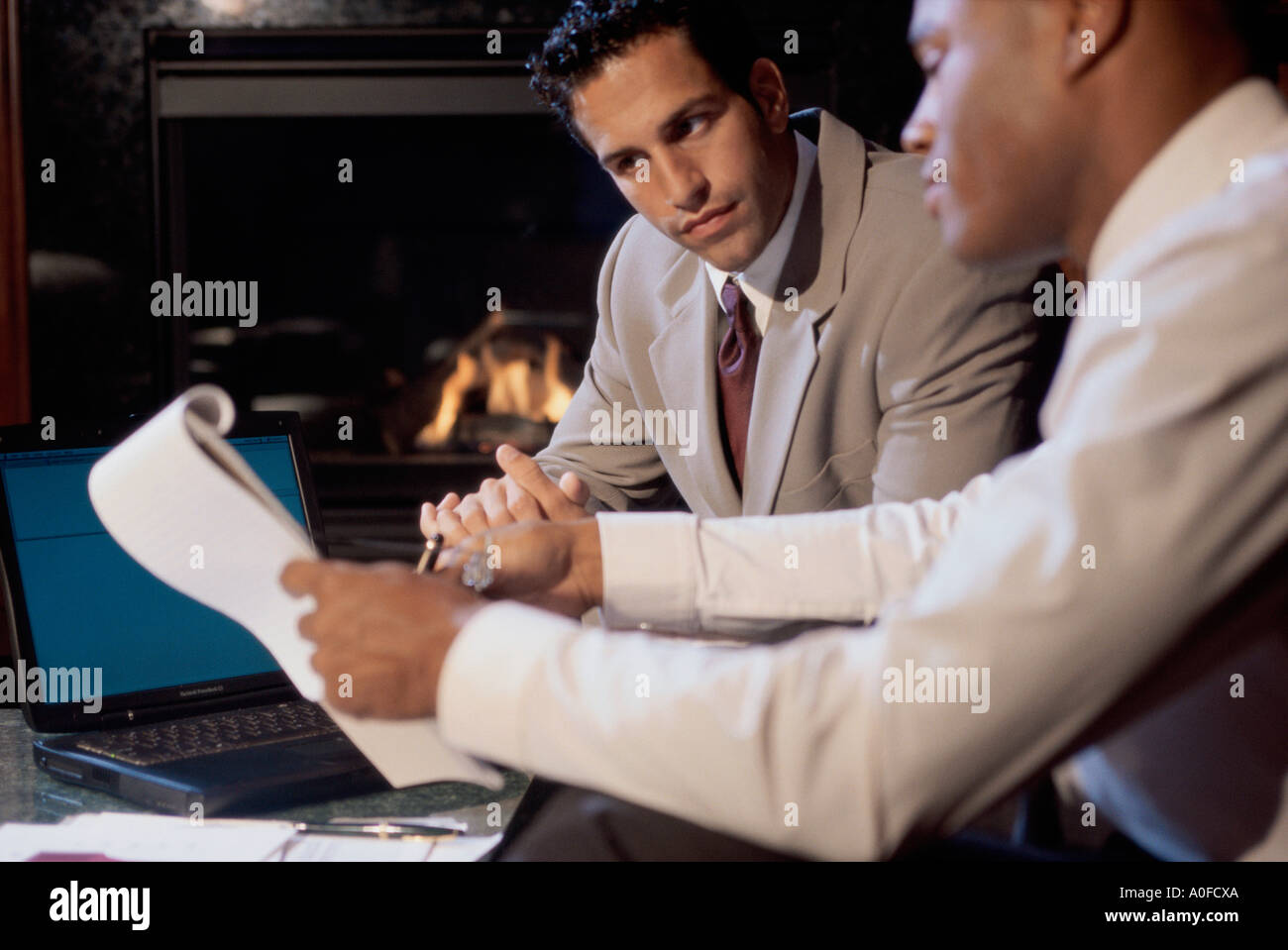 Two businessmen talking Stock Photo - Alamy