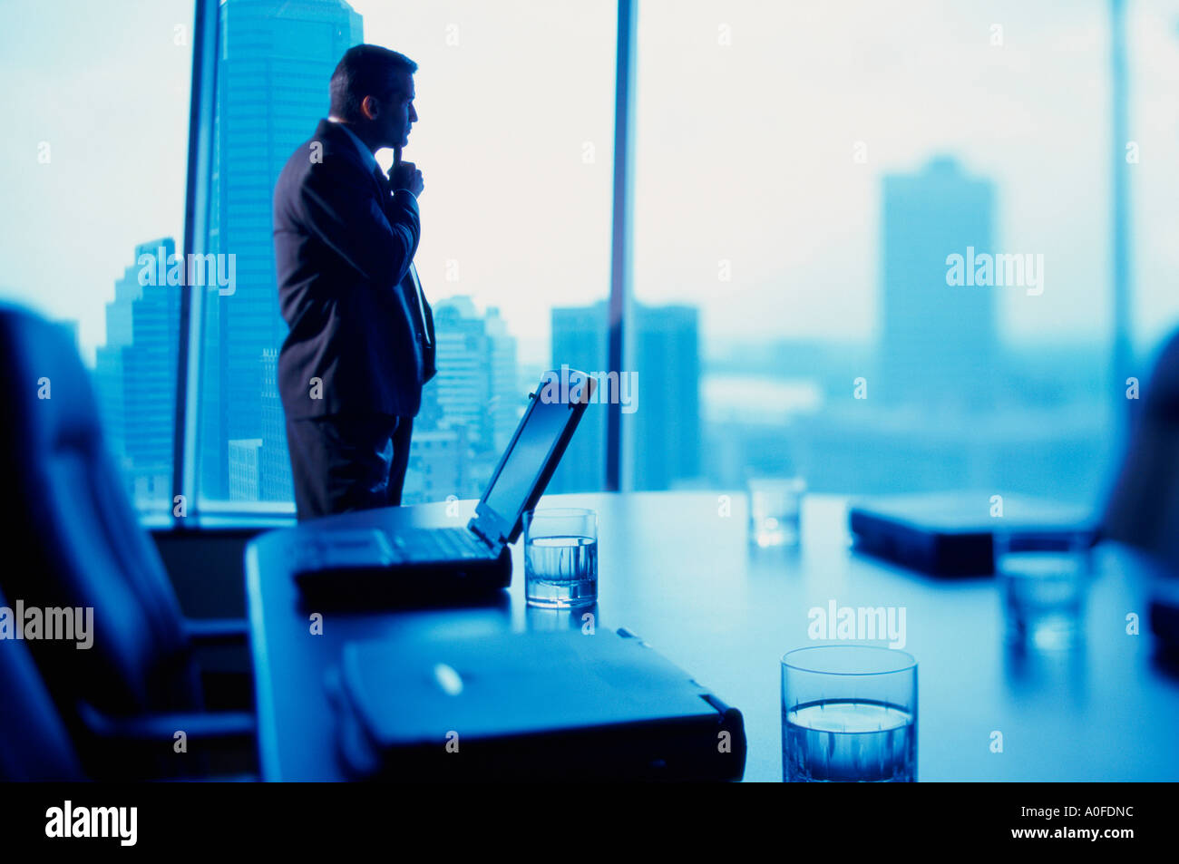 Side profile of a businessman thinking Stock Photo - Alamy