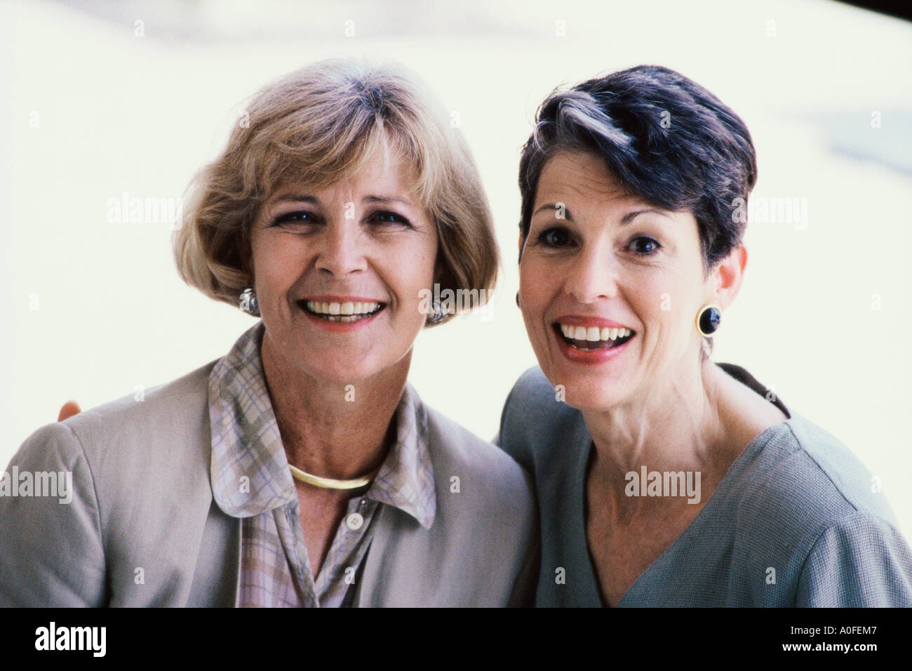 Portrait of two senior women smiling Stock Photo - Alamy