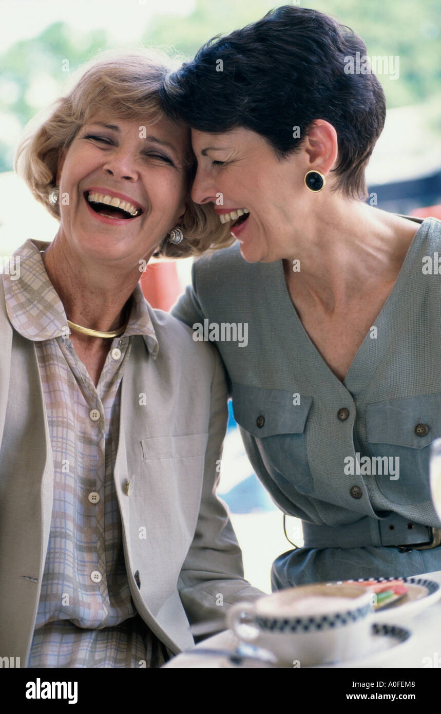Two mature women laughing Stock Photo - Alamy