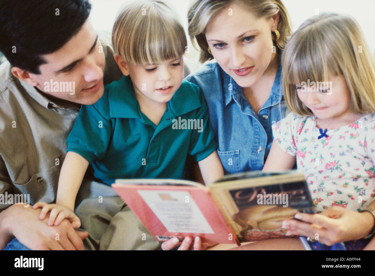 Multi generation family parents reading hi-res stock photography and ...