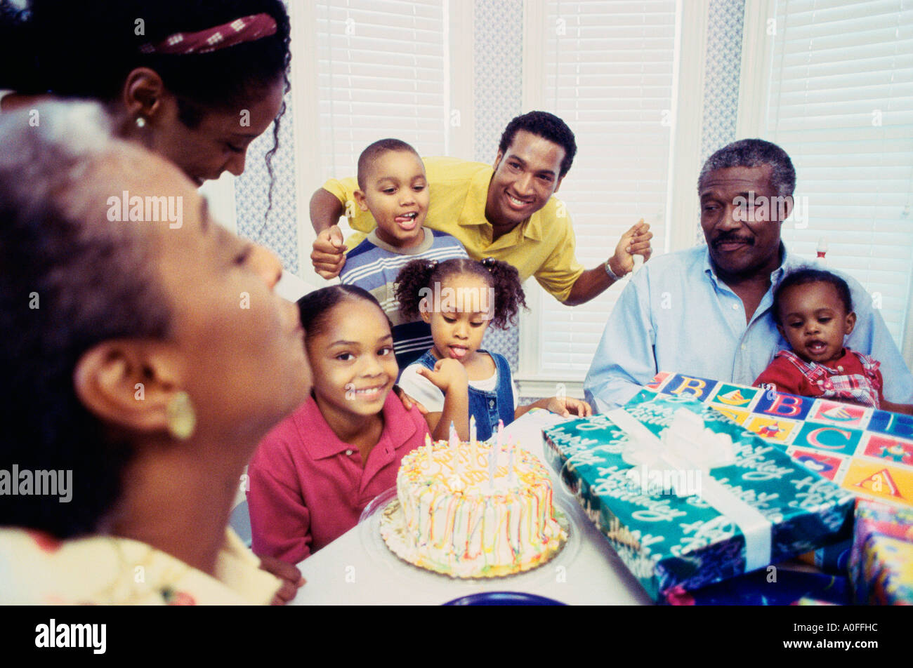 Family at a birthday party Stock Photo - Alamy