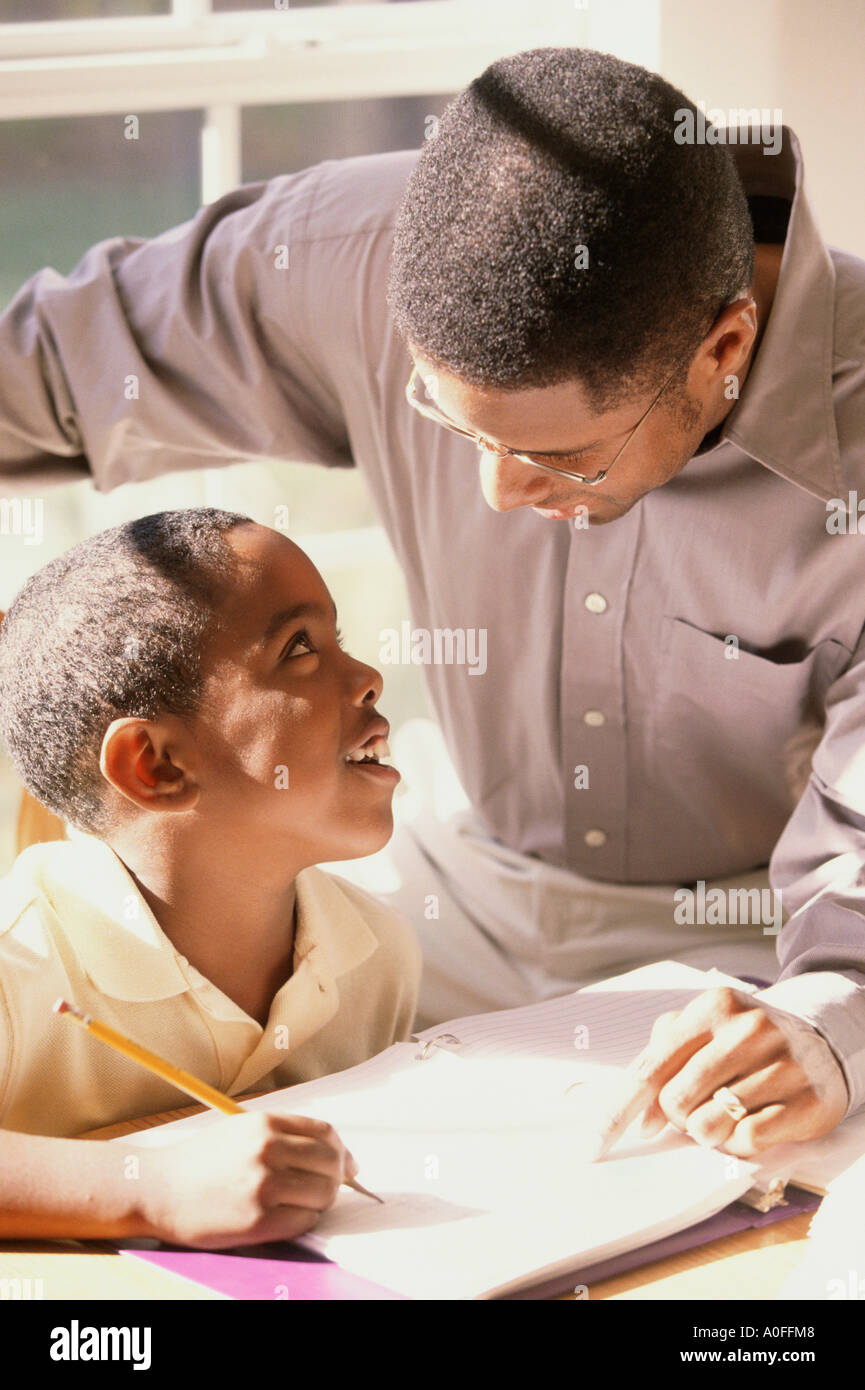 High angle view of a father teaching his son Stock Photo - Alamy