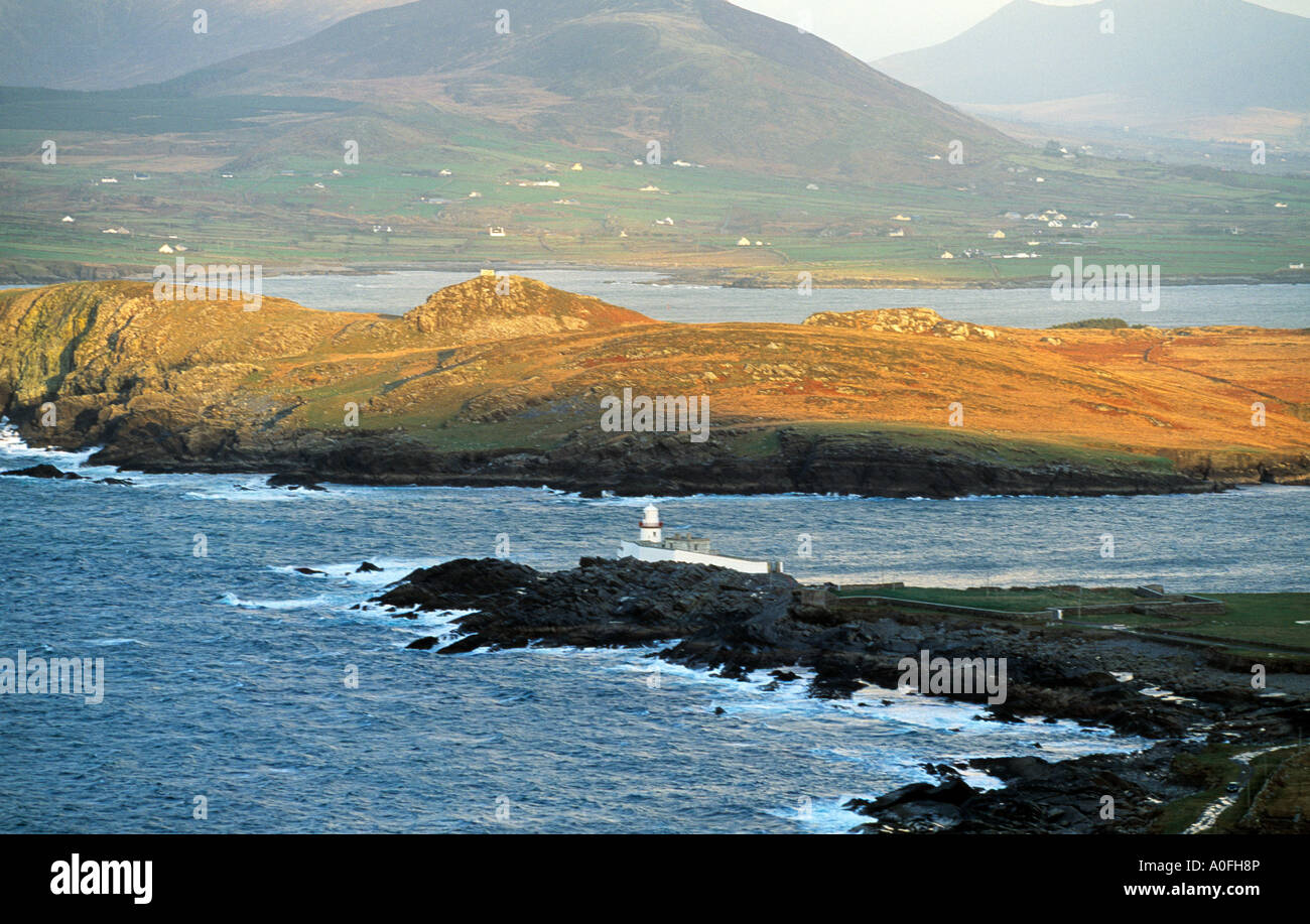 wild atlantic coastal lighthouse with narrow sea inlet and rough seas ...