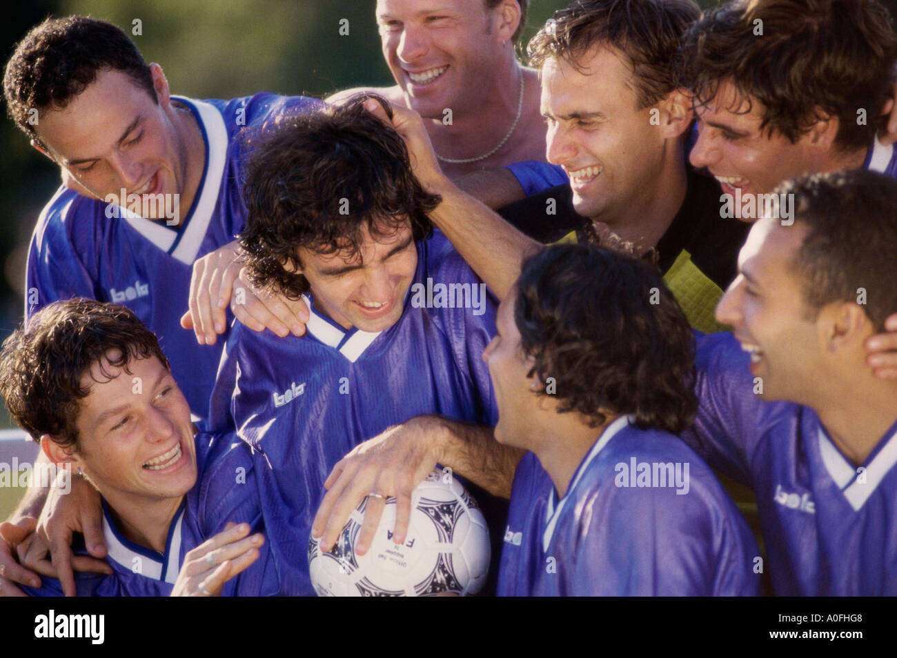 Soccer team laughing together Stock Photo - Alamy