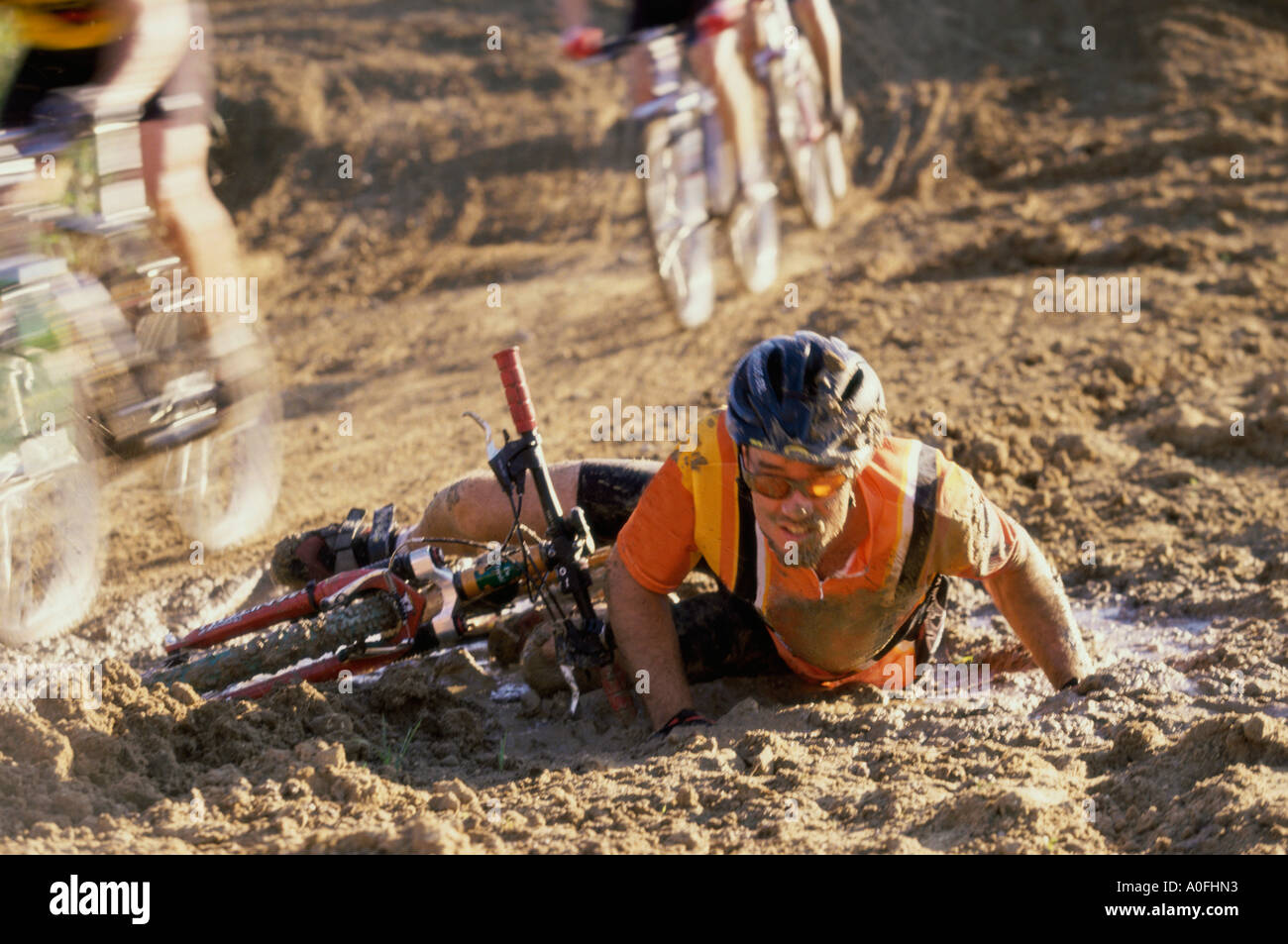 Young man falling from a bicycle in a race Stock Photo - Alamy