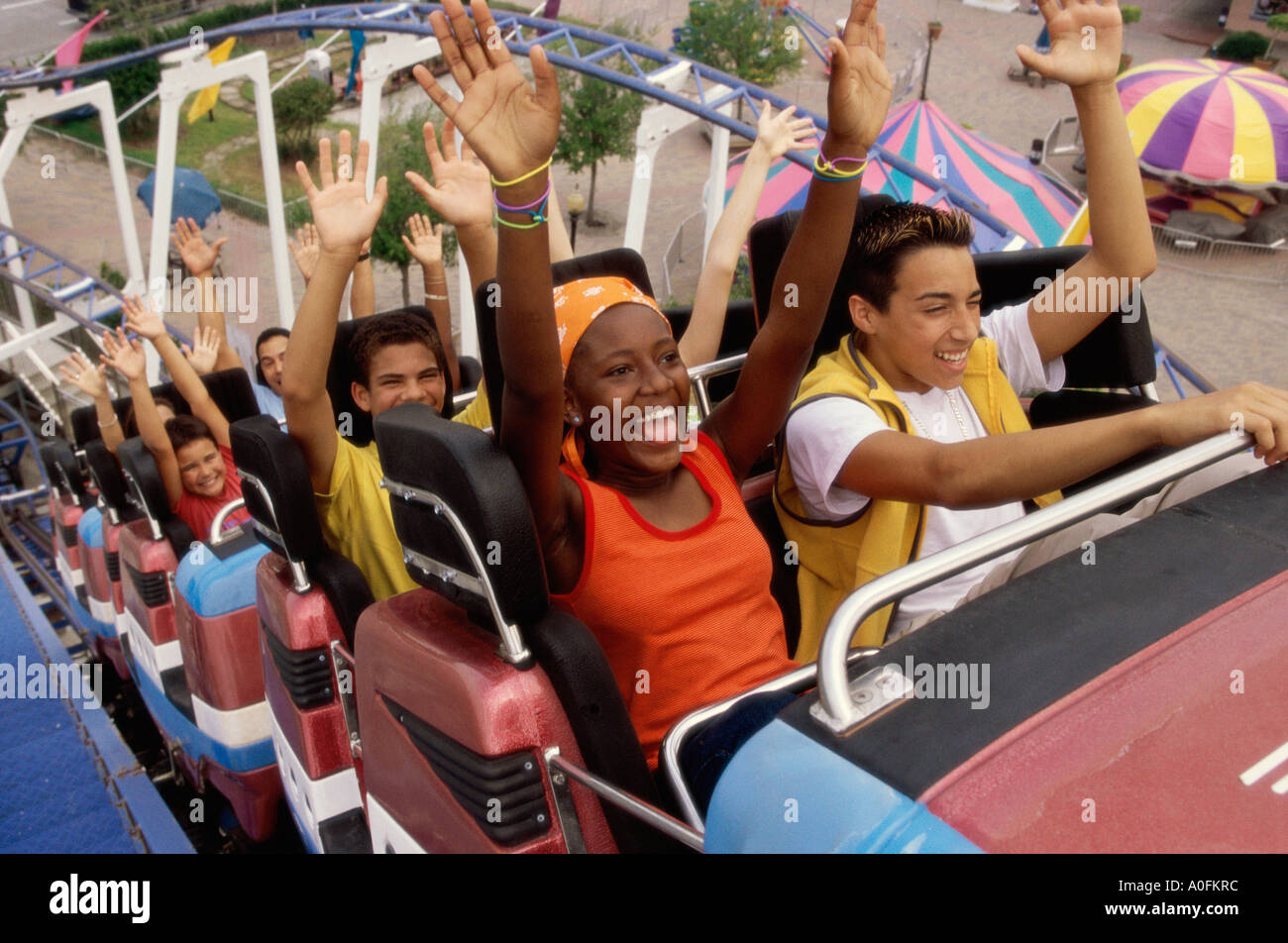 Group teenagers riding rollercoaster hi-res stock photography and ...