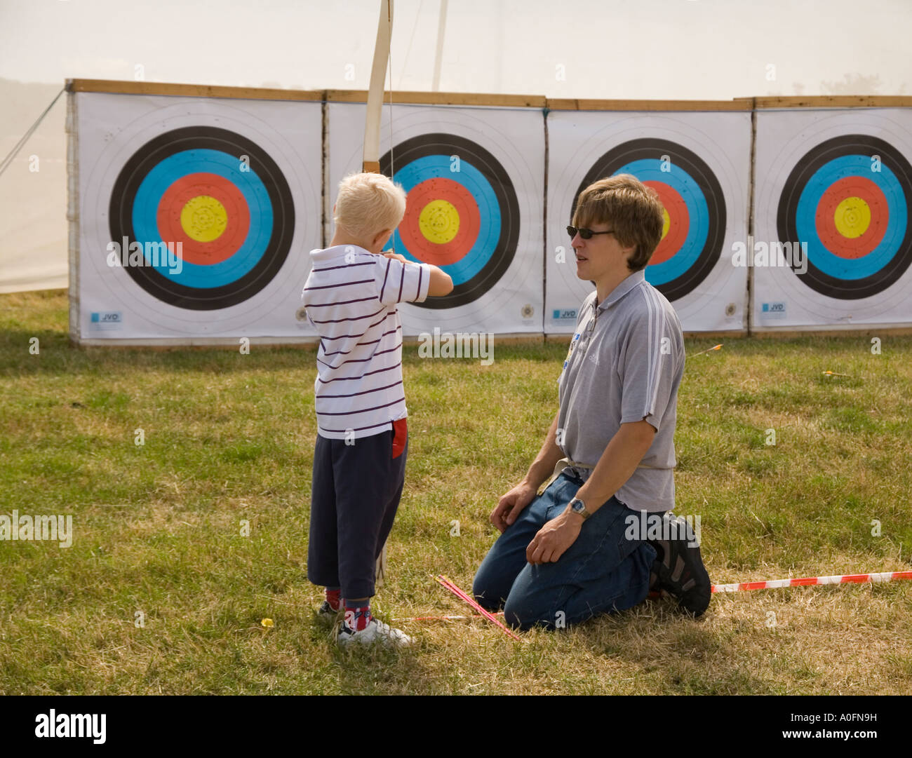 PENTRAETH ISLE OF ANGLESEY NORTH WALES UK August A small boy lining up ...