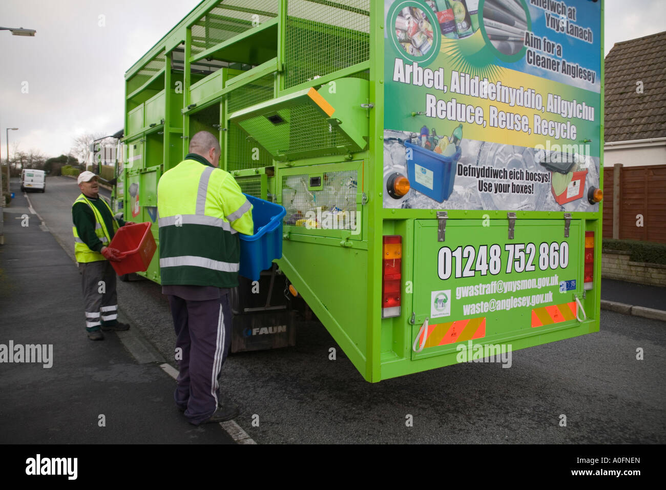 ANGLESEY NORTH WALES UK December Two men collecting household recycled ...