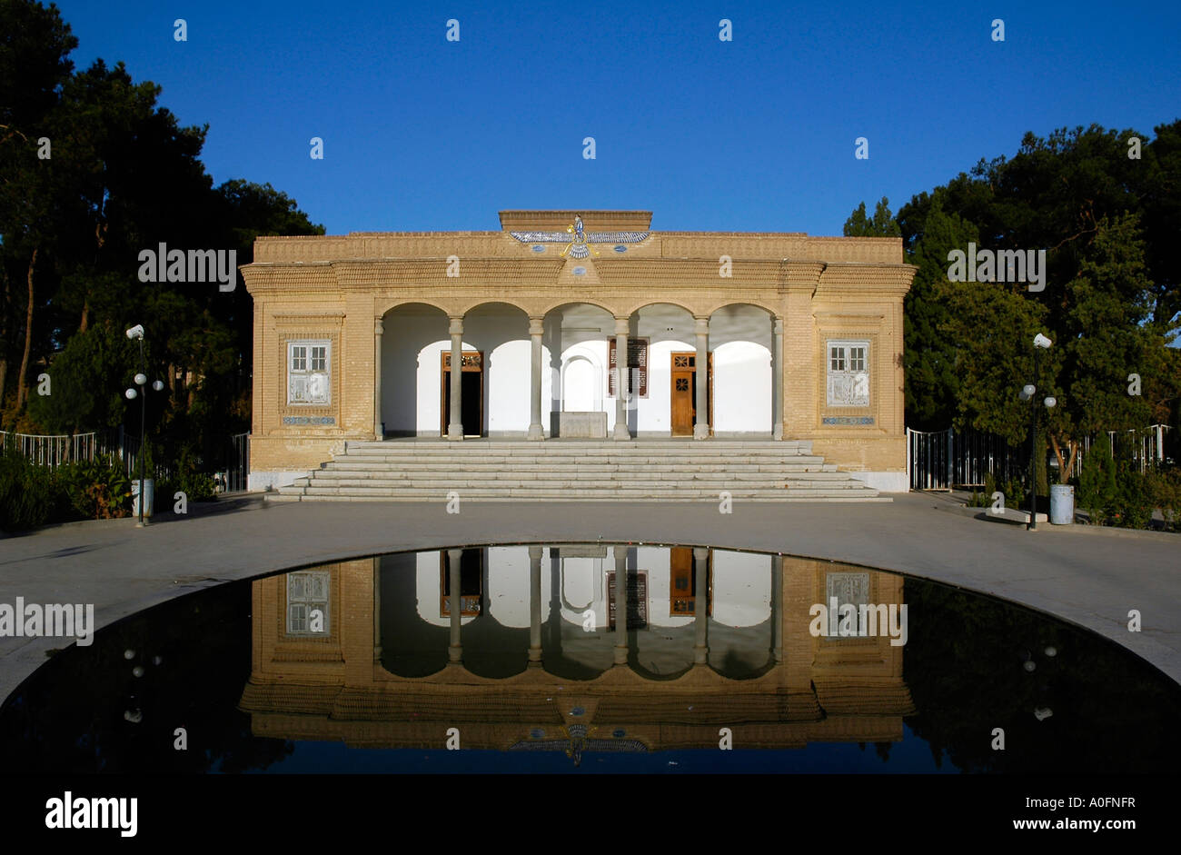 The Zoroastrian Fire Temple reflected in its garden pond, Yazd, Iran ...