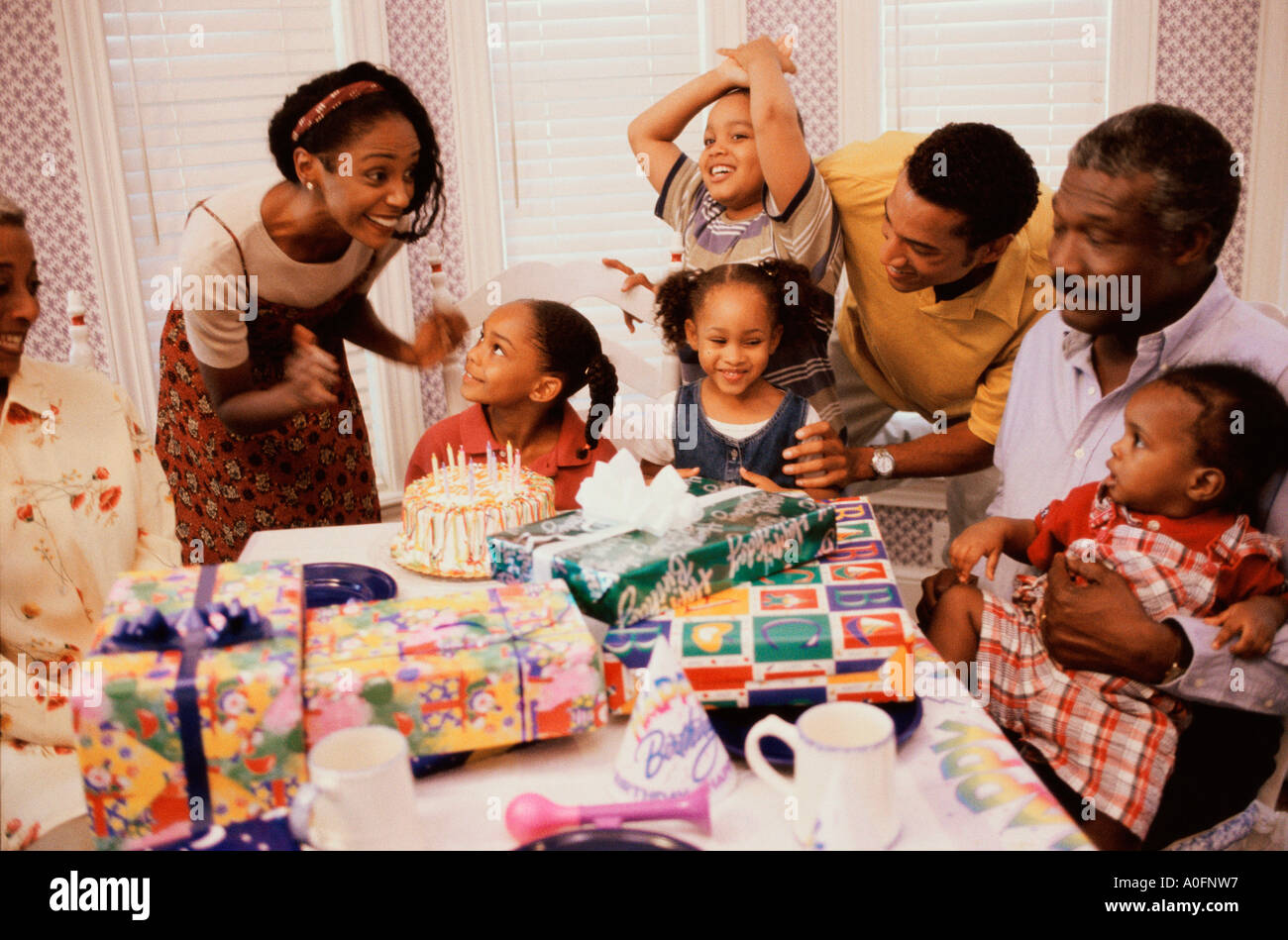 Family celebrating a birthday party Stock Photo - Alamy