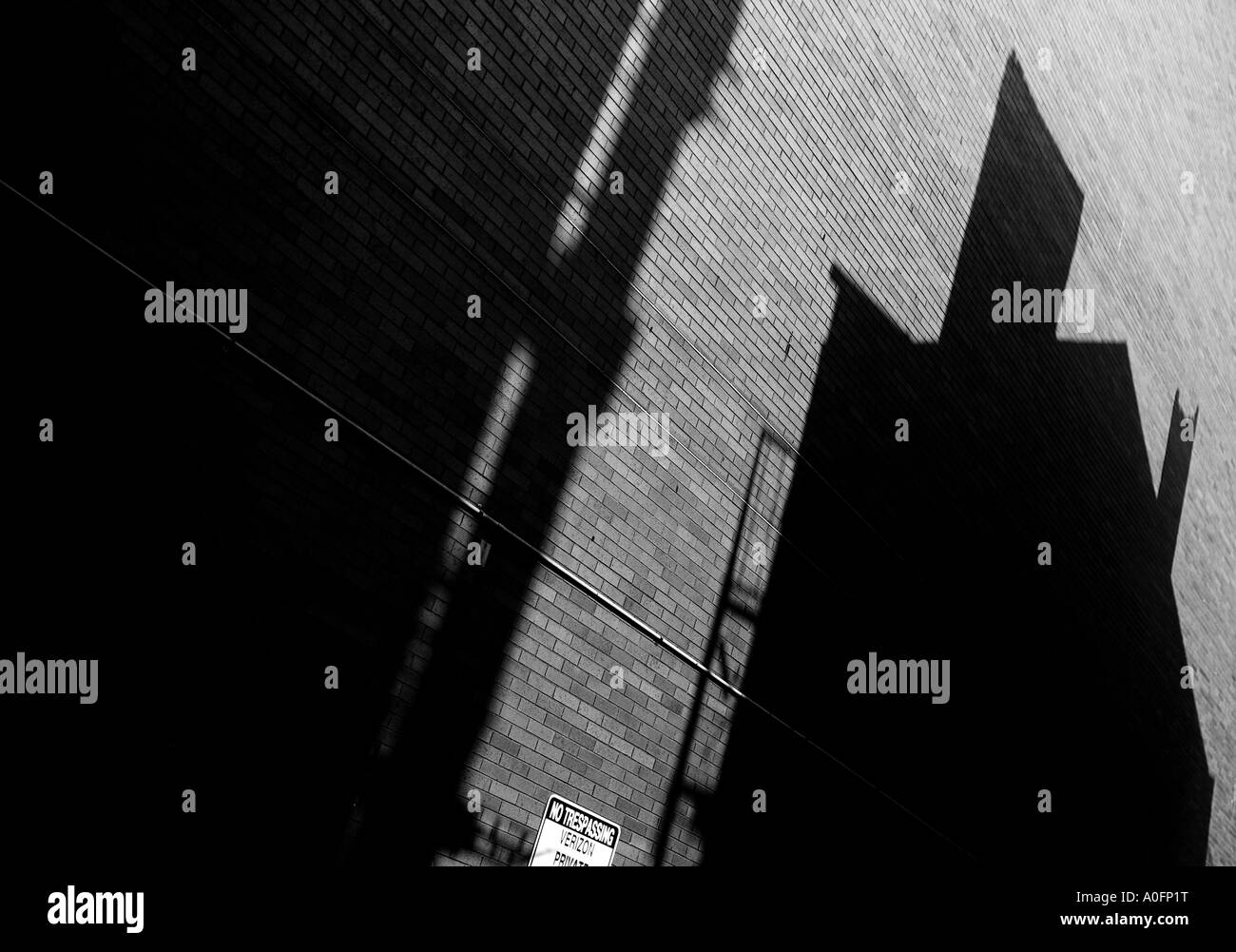shadow cast by building on brick brownstone building in chinatown Stock ...