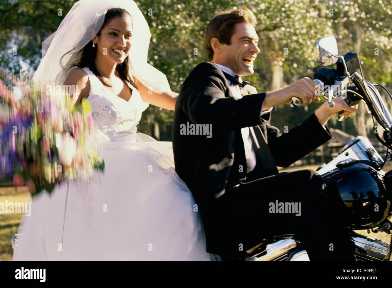 Bride and groom on motorcycle hi-res stock photography and images - Alamy