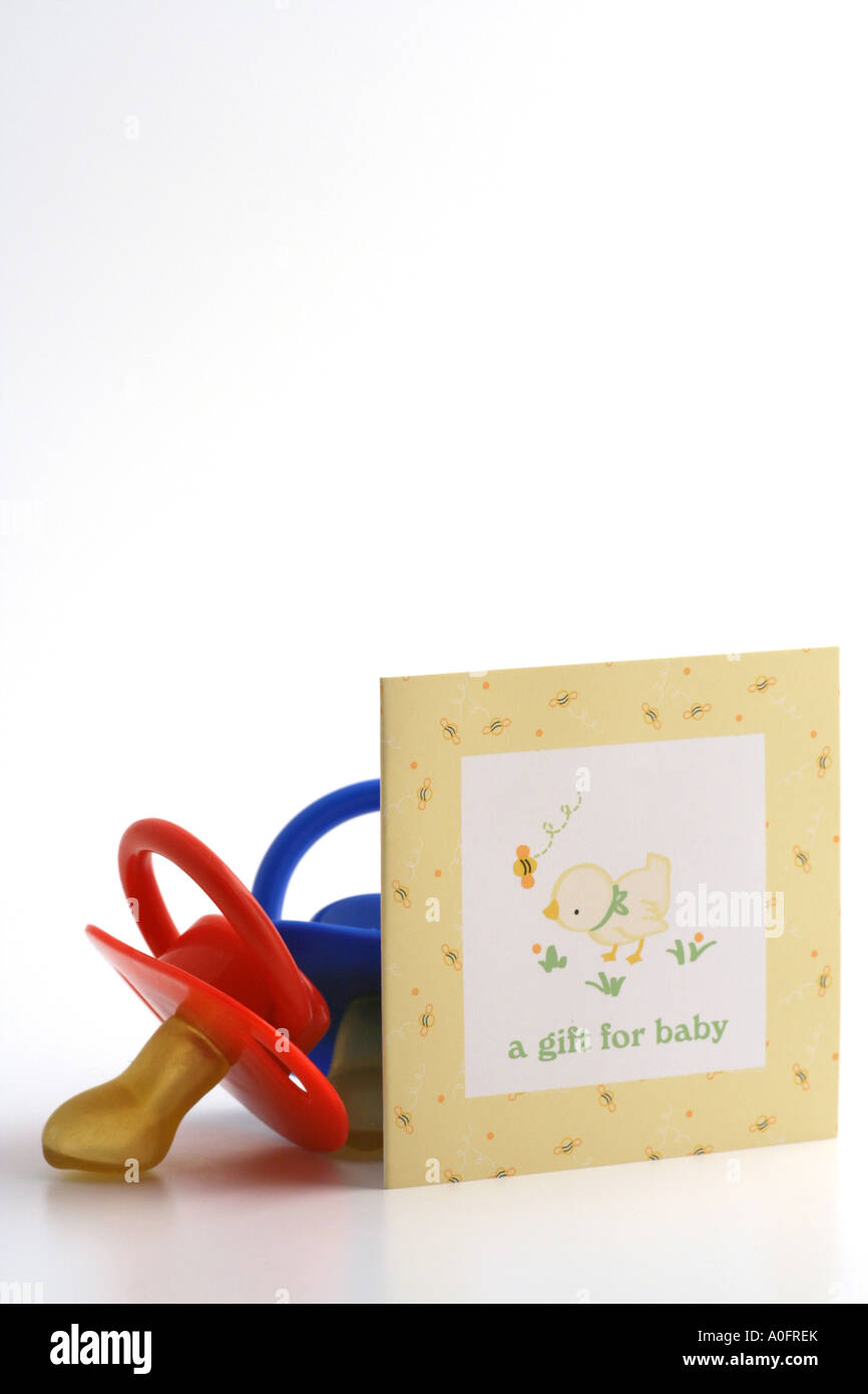 Red and blue pacifiers, with gift card Stock Photo - Alamy