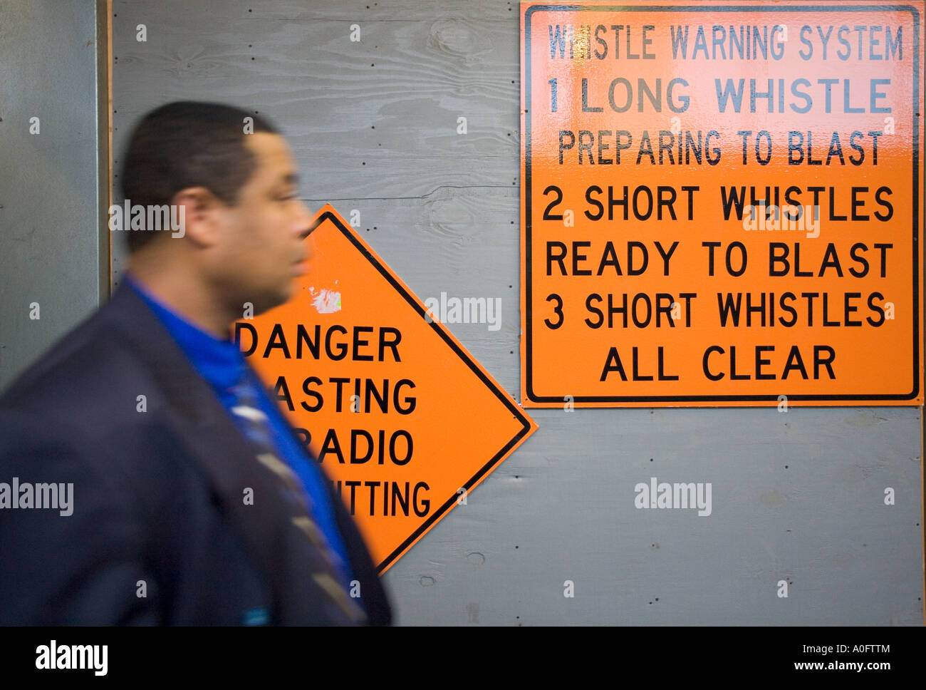 black man and orange blast signs in ground zero Stock Photo - Alamy