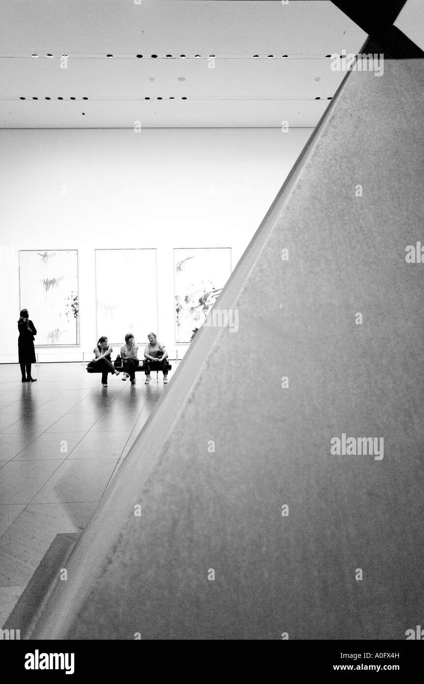 people and guards inside moma museum of modern art architecture ...