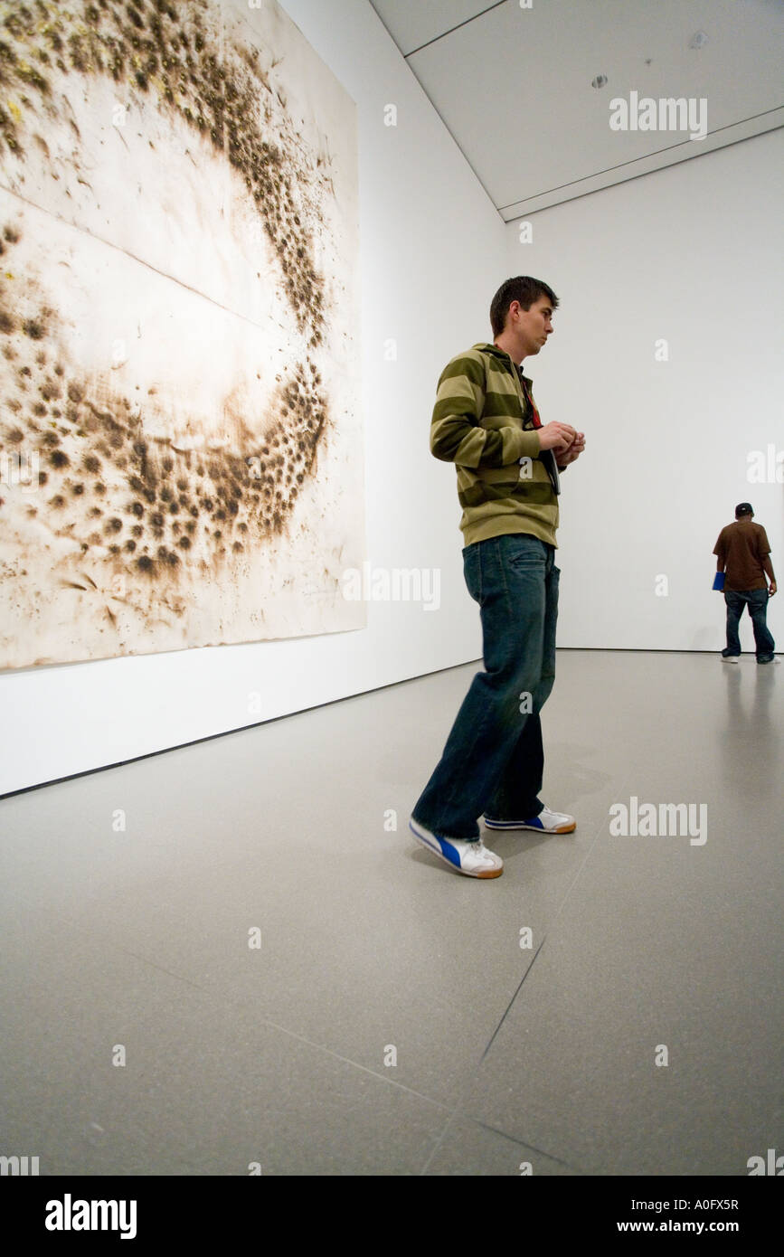 people and guards inside moma museum of modern art architecture ...