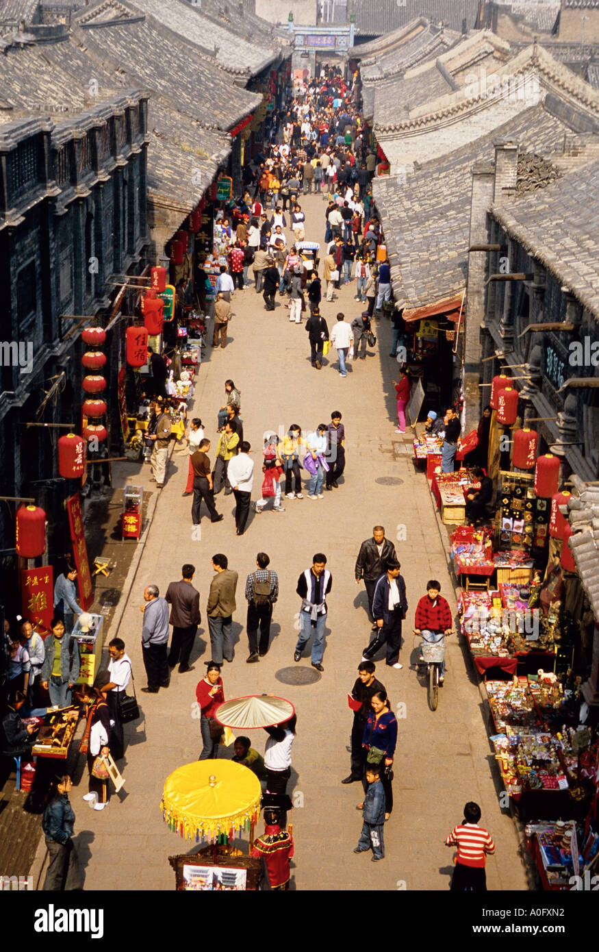 Pingyao, Shanxi, China - Busy business street in the ancient walled ...