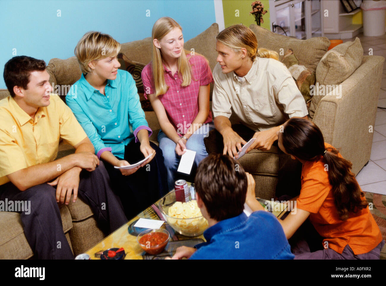 Group of teenagers having a group discussion Stock Photo - Alamy