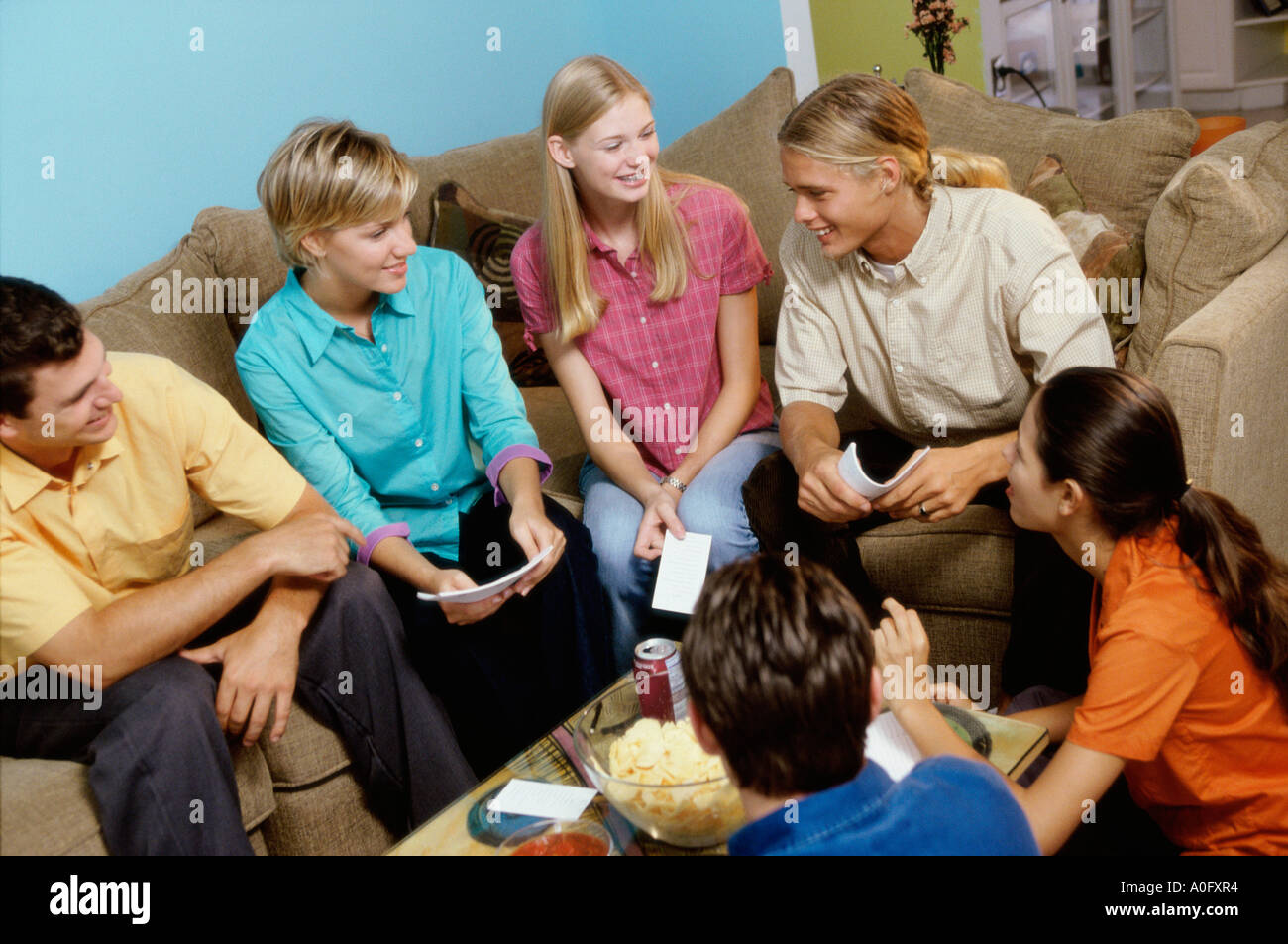 Group of teenagers having a group discussion Stock Photo - Alamy