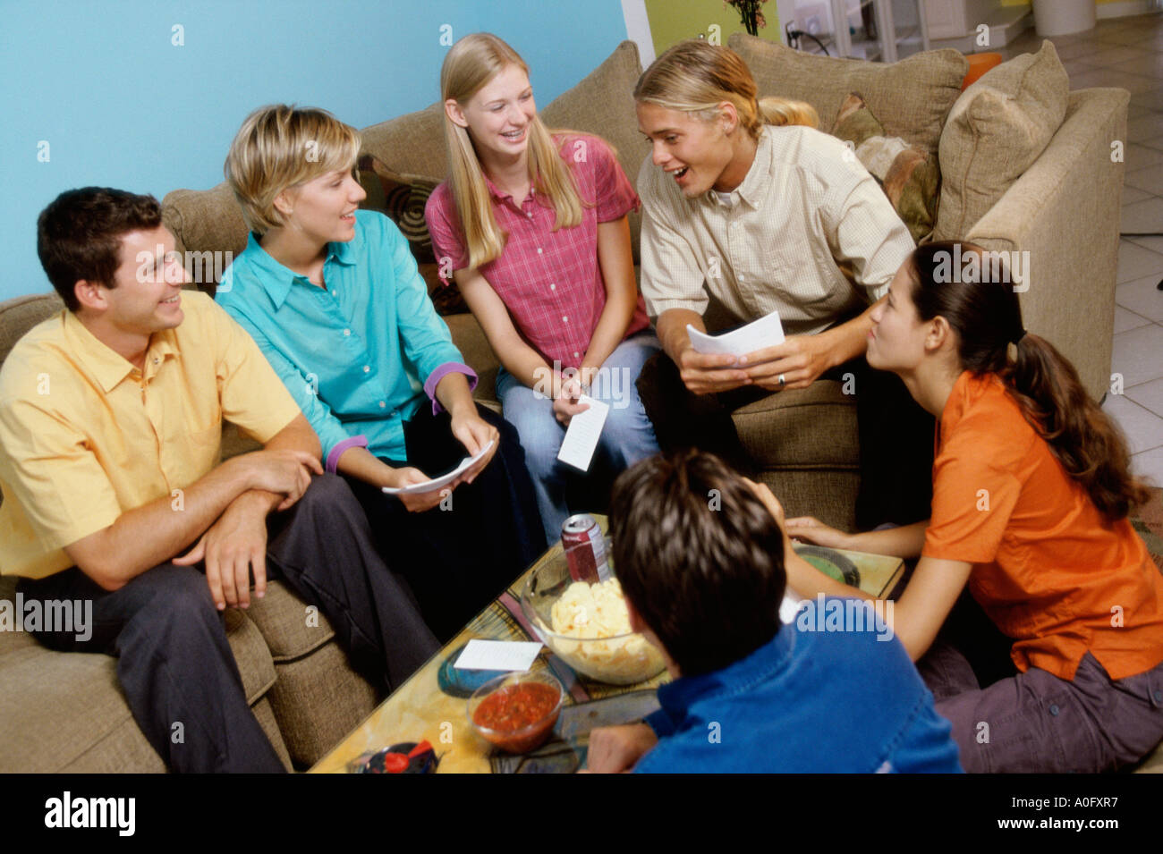 Group of teenagers having a group discussion Stock Photo - Alamy