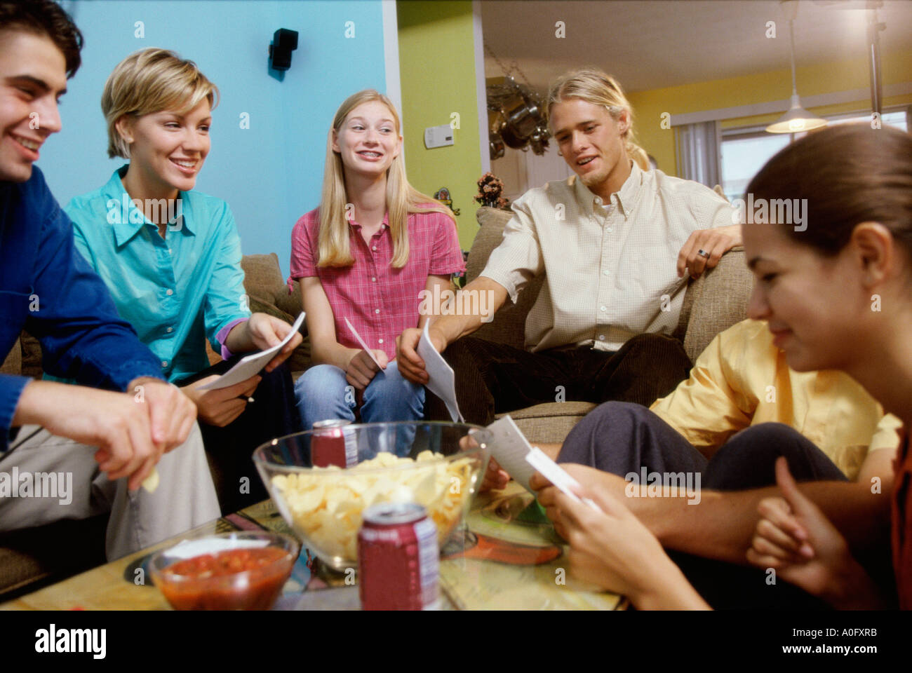 Group of teenagers having a group discussion Stock Photo - Alamy