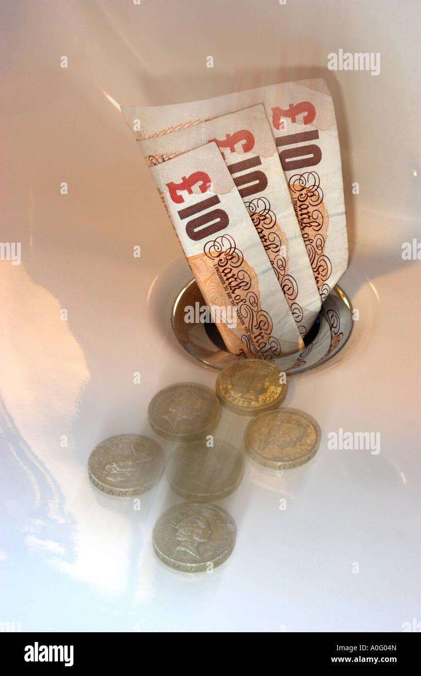 Throwing money down the drain hi-res stock photography and images - Alamy
