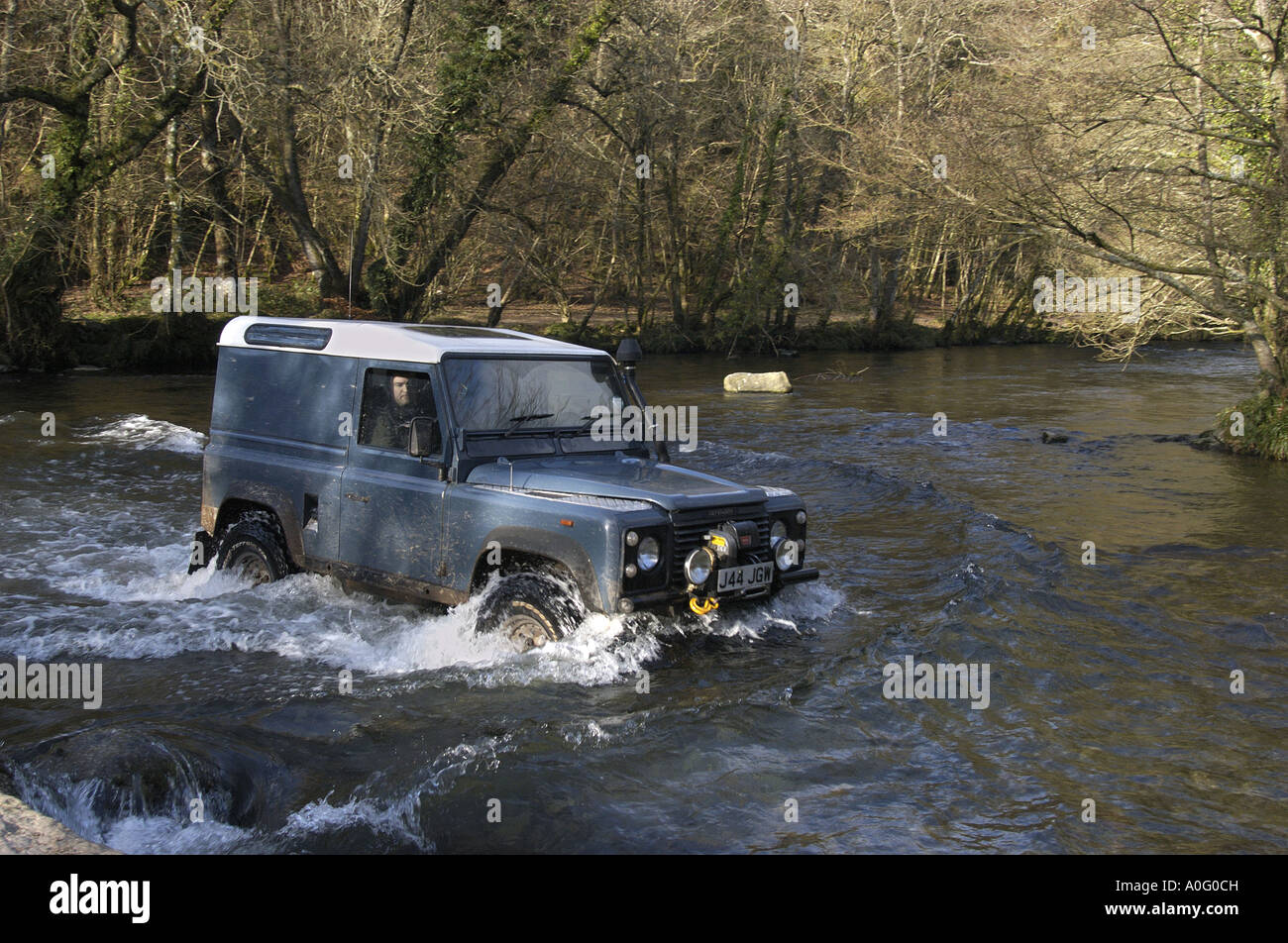 Land Rover crossing ford at Tarr Steps Ancient monument on Exmoor ...