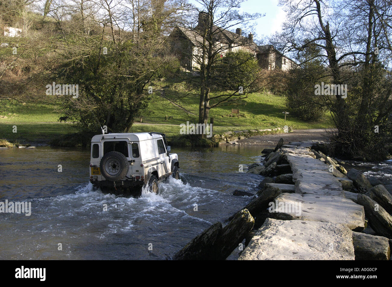 Land Rover crossing ford at Tarr Steps Ancient monument on Exmoor ...