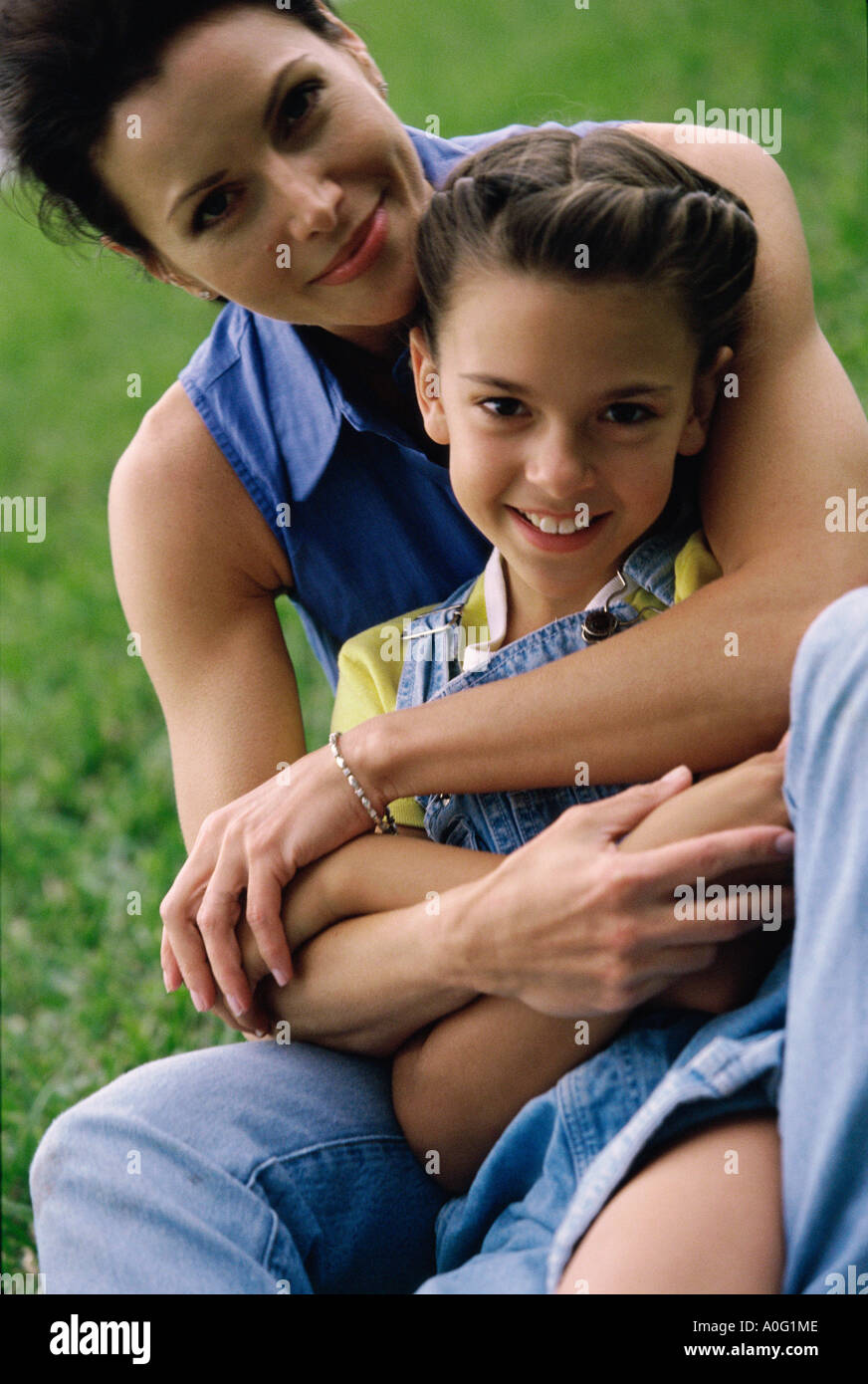 Mother hugging her daughter Stock Photo - Alamy