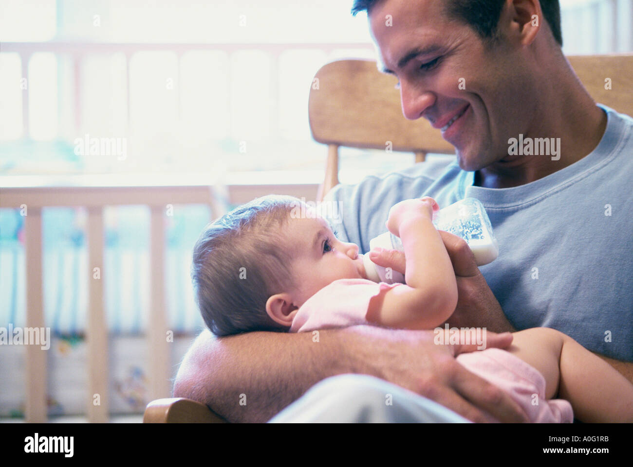Father feeding his baby boy Stock Photo - Alamy