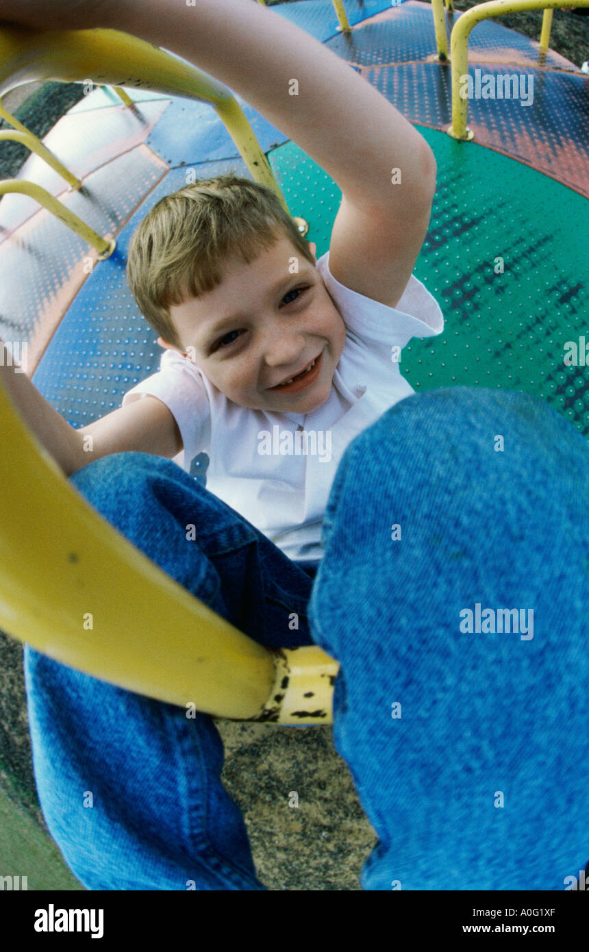 Portrait of a boy on a merry-go-round Stock Photo - Alamy