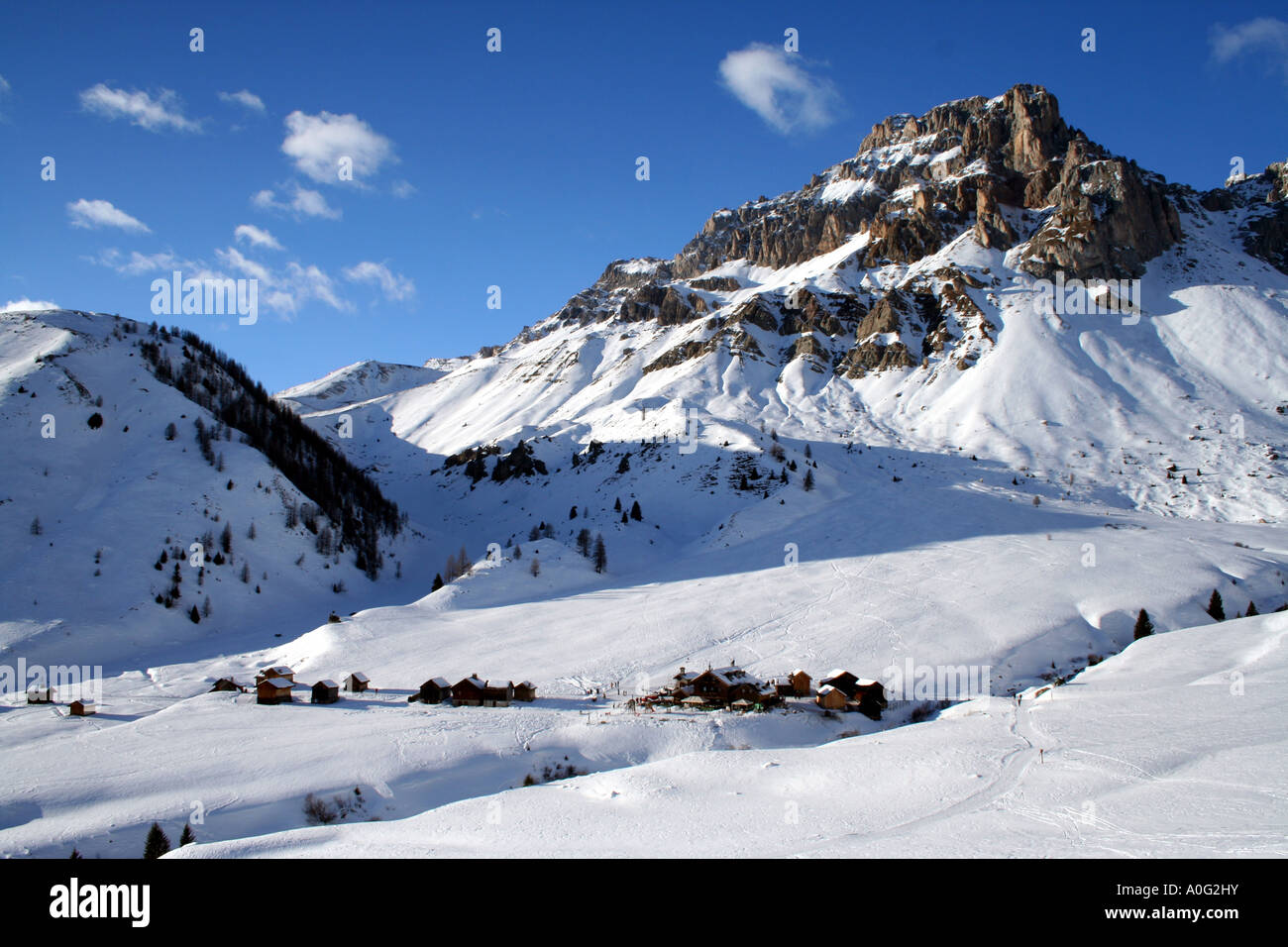 Cluster of welcoming huts in winter at Fuchiade below the snowbound ...