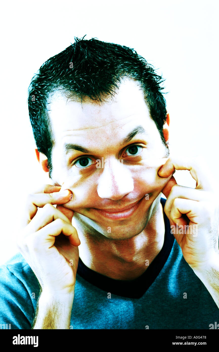 Young man pulling stupid face hi-res stock photography and images - Alamy