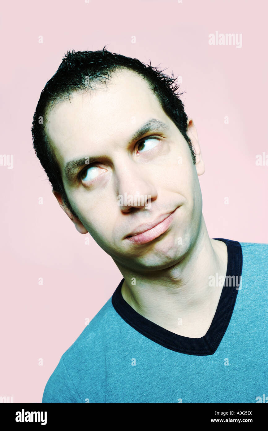 Young man pulling stupid face hi-res stock photography and images - Alamy