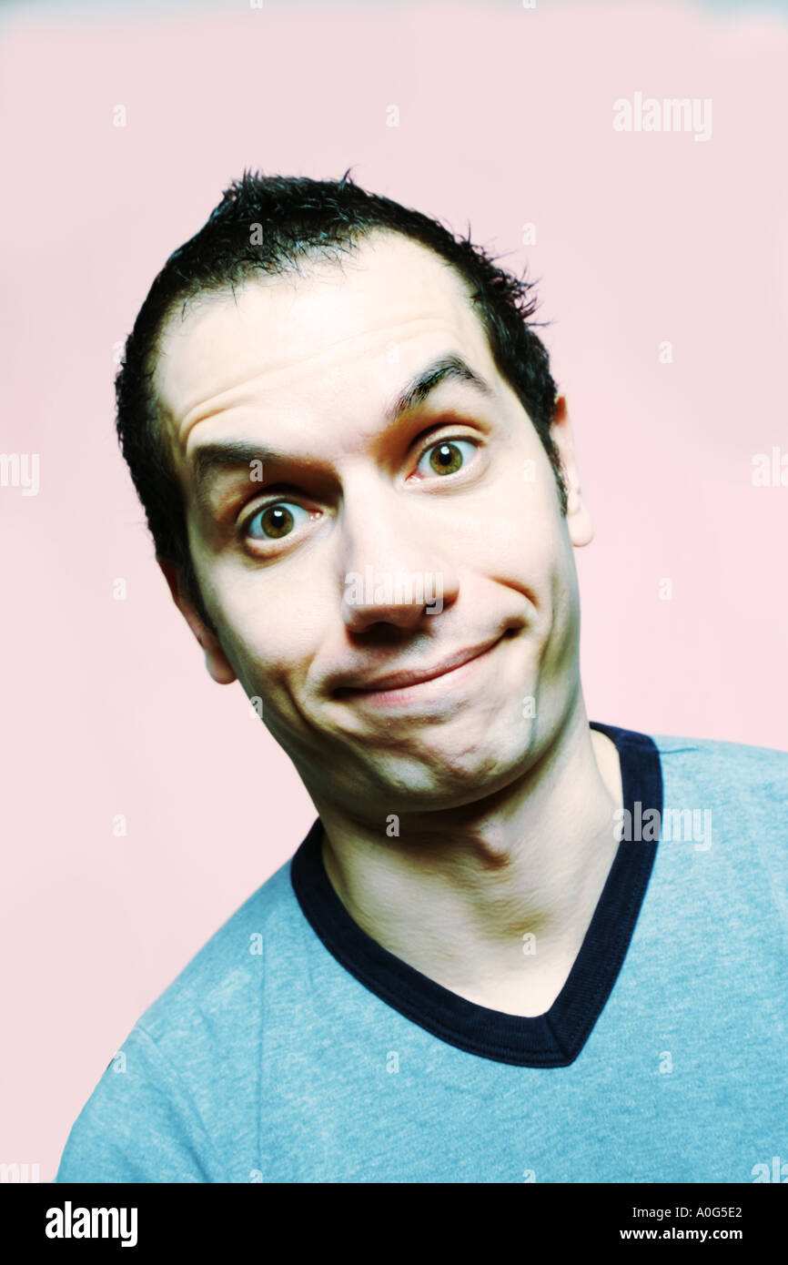 Young man pulling stupid face hi-res stock photography and images - Alamy