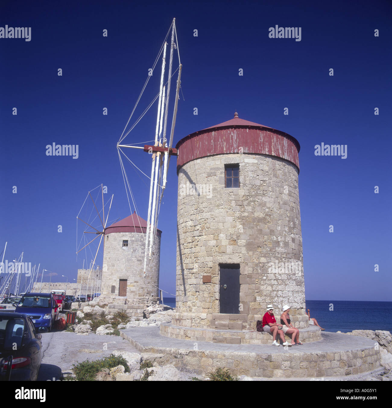 Medieval Windmills at Mandraki Harbour Stock Photo - Alamy