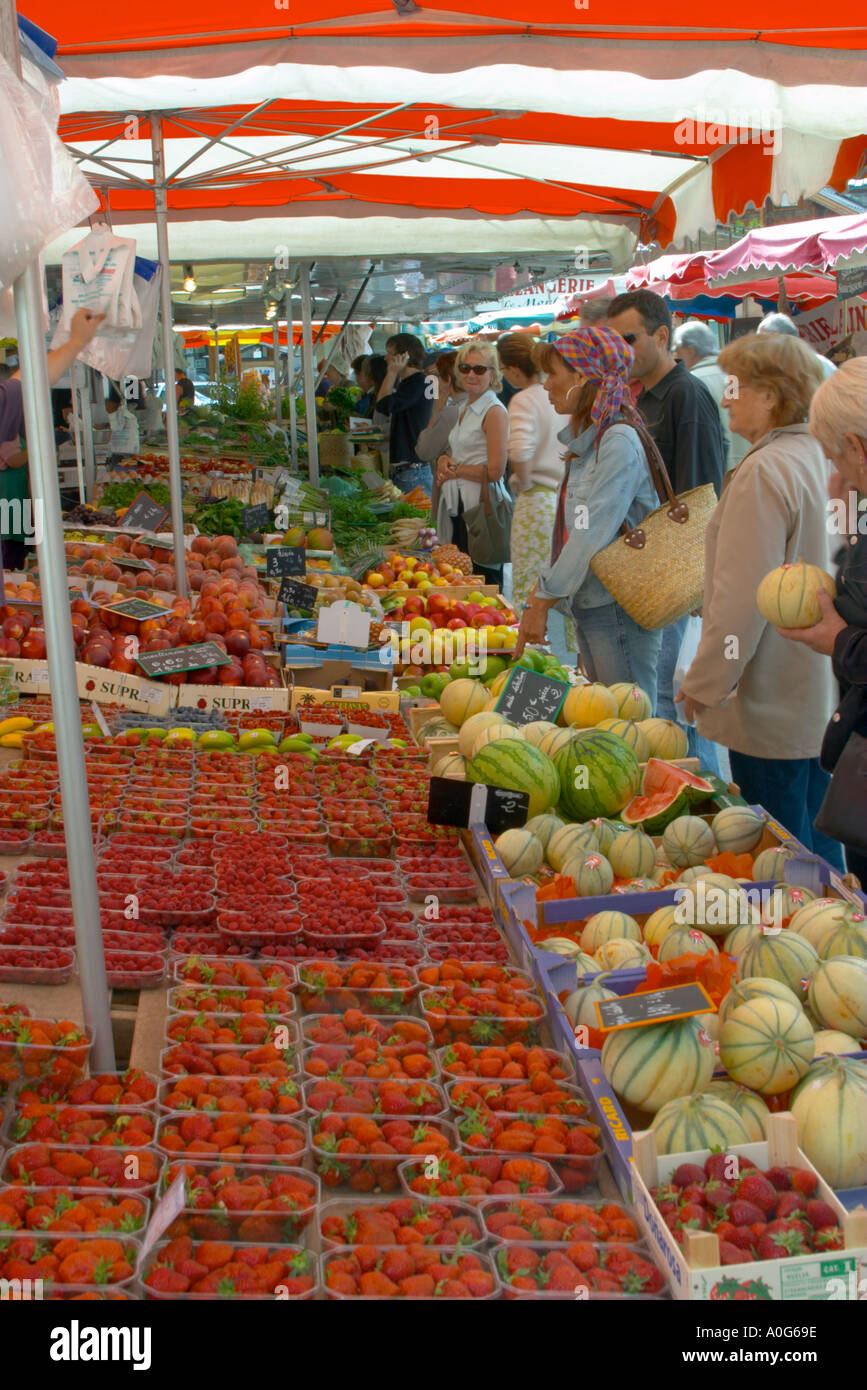 Strawberries, melons and other fruit stall at a French outdoor market ...