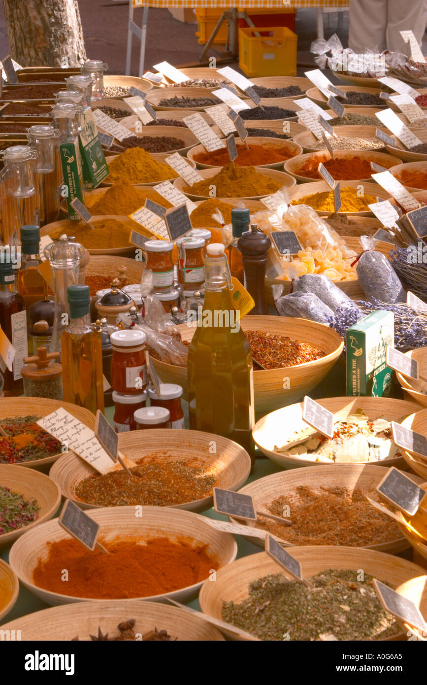 Spice stall at French outdoor market. Herbs and spices displayed in ...