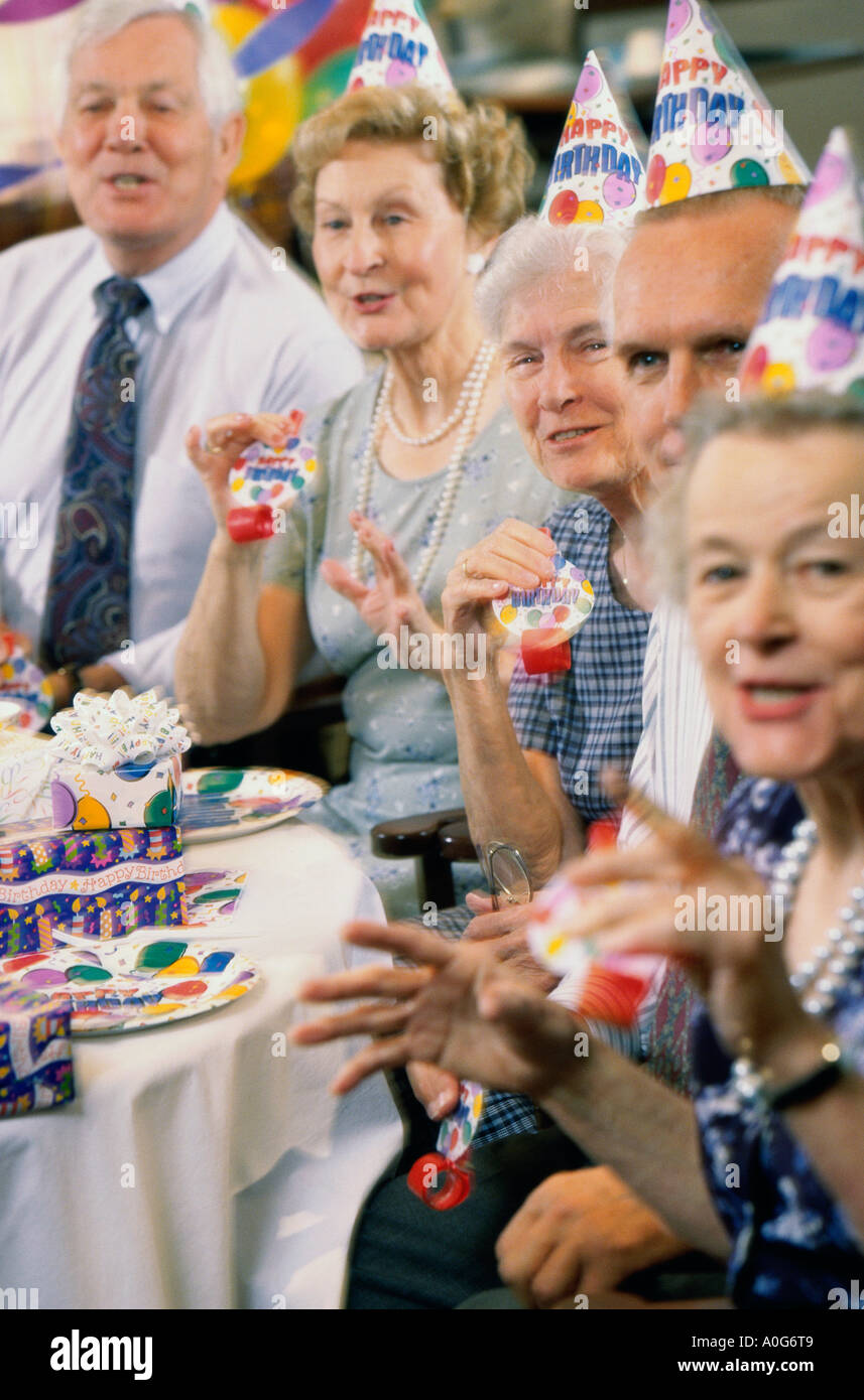 Group of senior people celebrating at a birthday party Stock Photo - Alamy