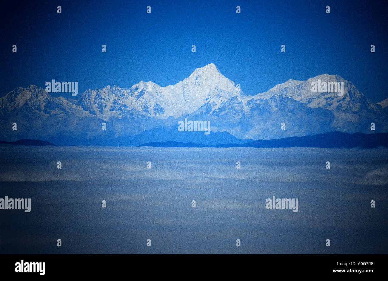 Emeishan, Sichuan, China - View of 7565 meter high Mount Gonga piercing ...