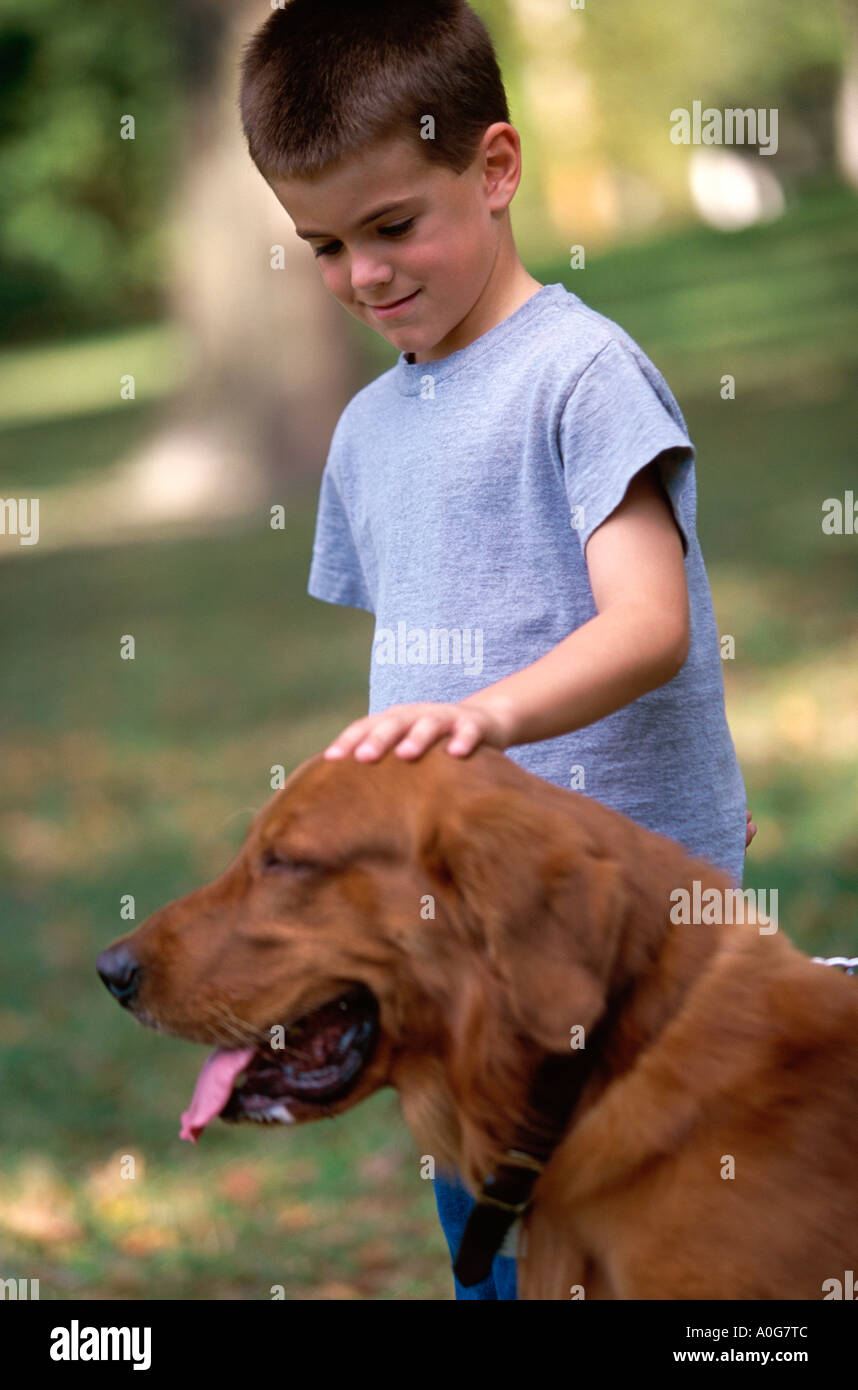 Boy petting his dog hi-res stock photography and images - Alamy